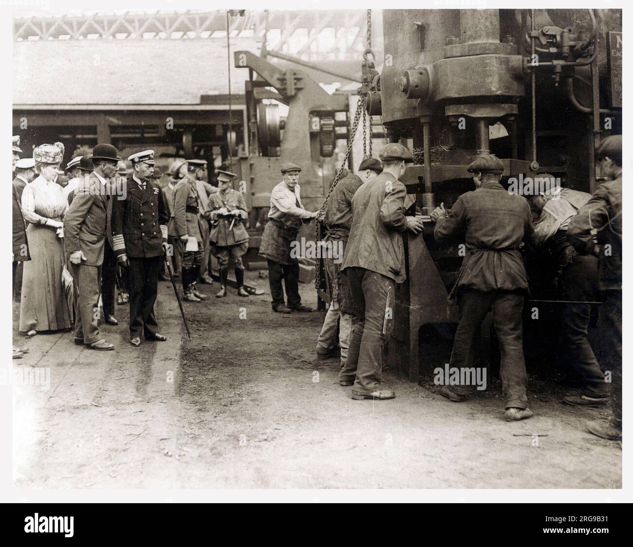 King George V (1865-1936) and Queen Mary (1867-1953) visit a factory ...