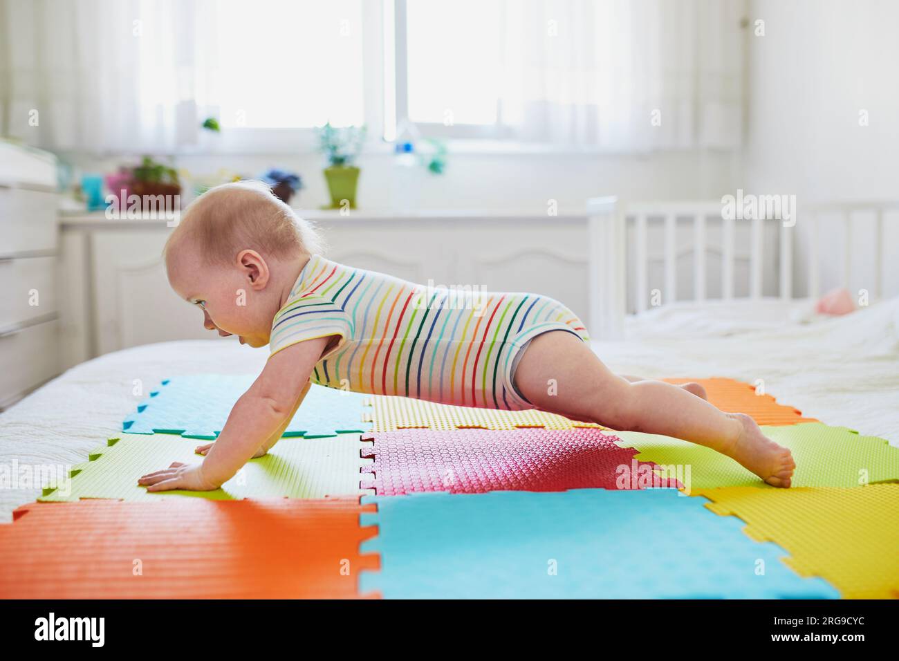 Child lifting arms hi-res stock photography and images - Alamy