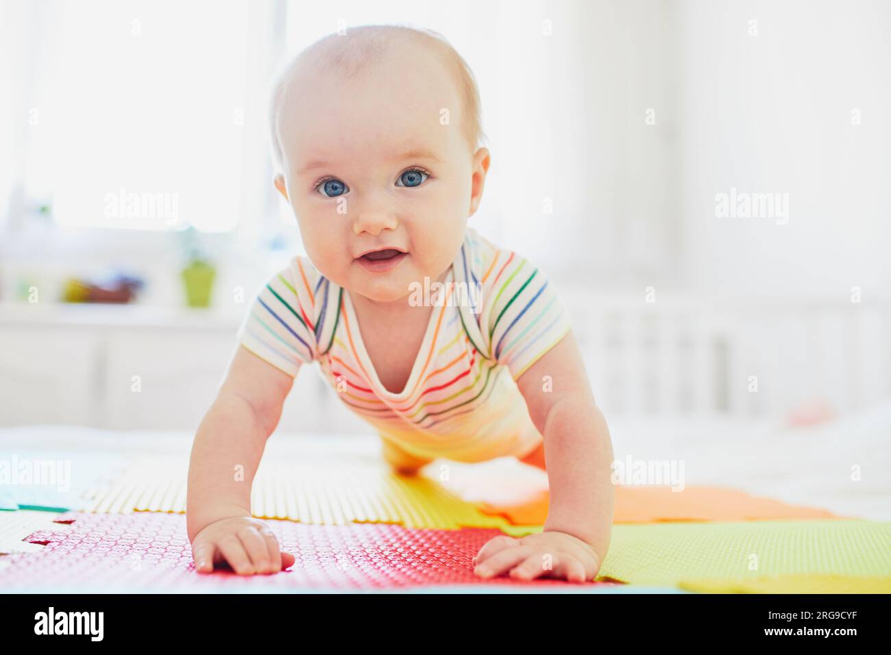 Child lifting arms hi-res stock photography and images - Alamy