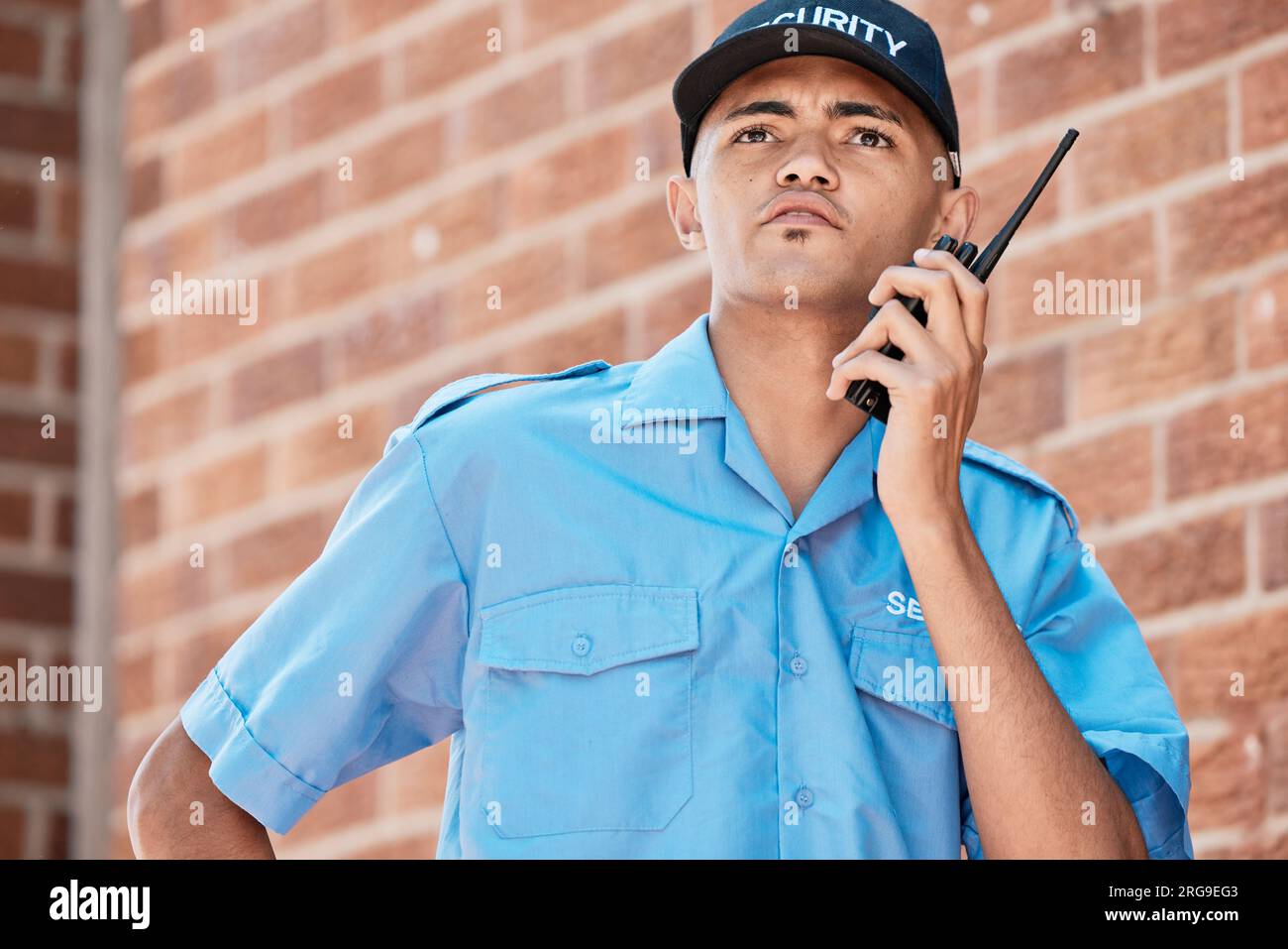 Man, walkie talkie and security guard in city in conversation ...