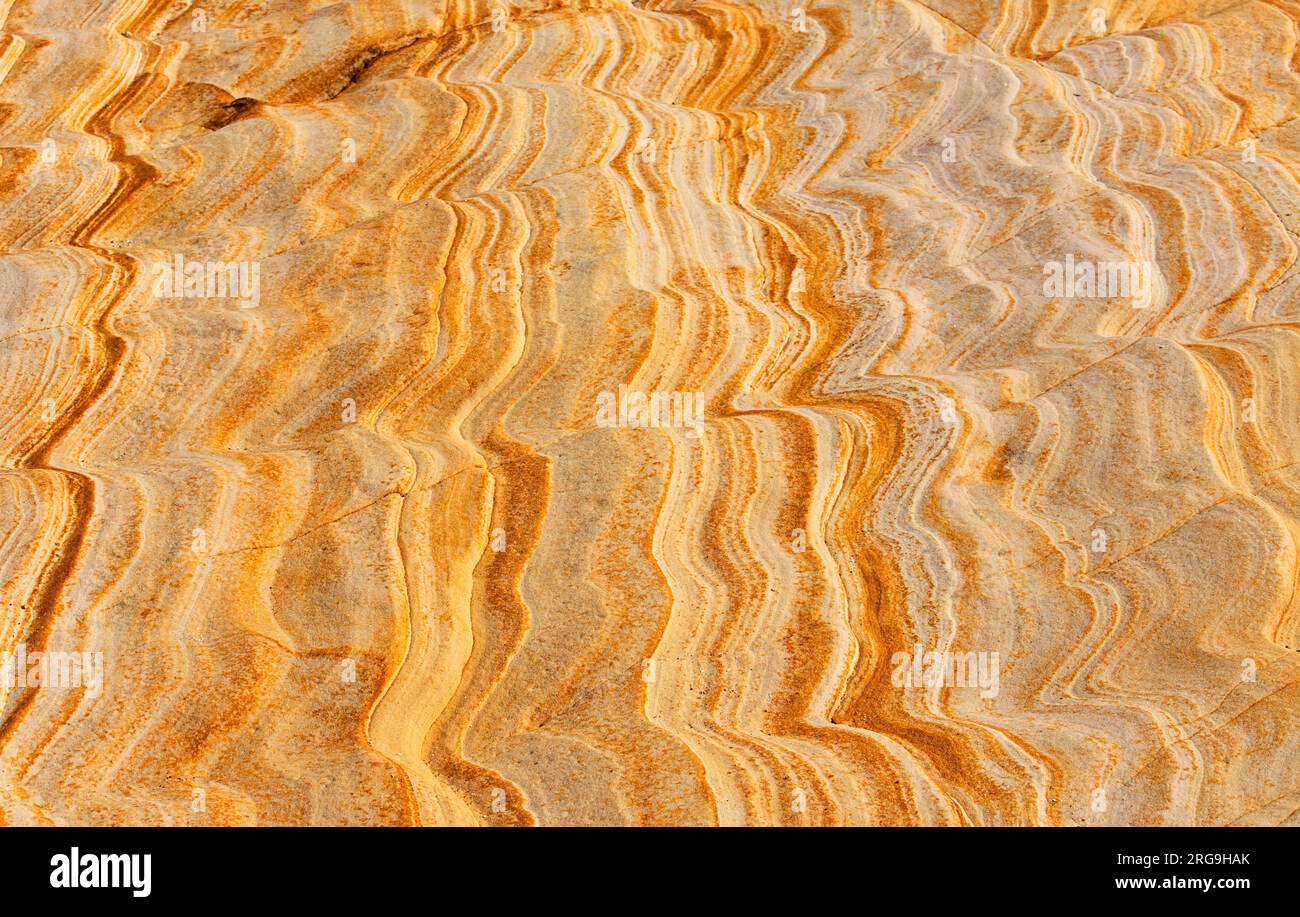 Hopeman Beaches wave patterns on beach rocks consisting of Hopeman ...
