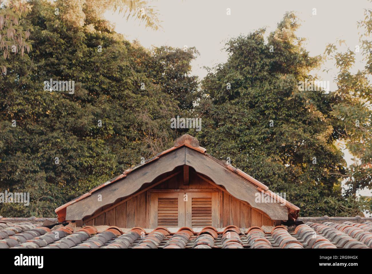 small wooden window on the roof Stock Photo - Alamy