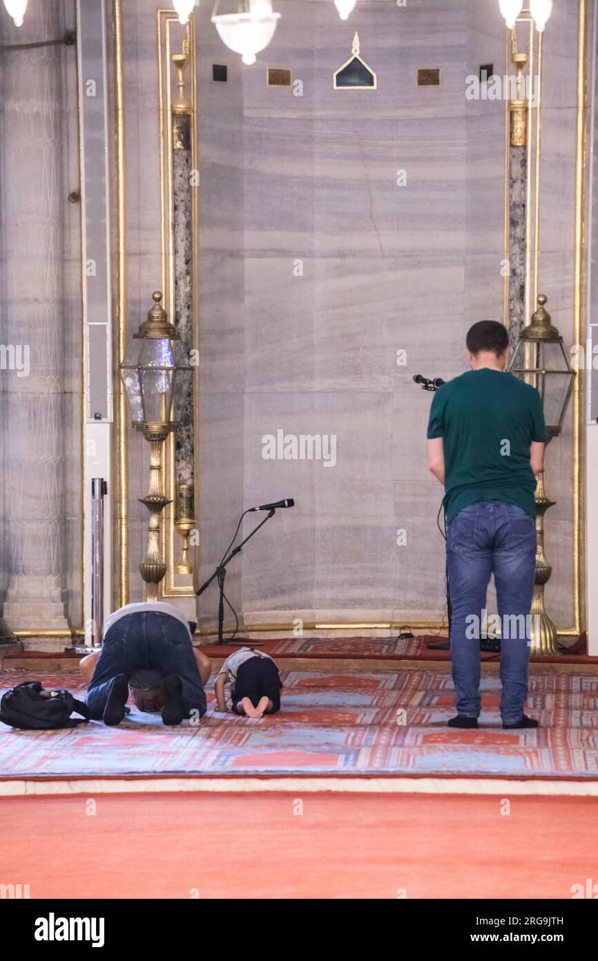 Istanbul, Turkey, Türkiye. Father and Young Son Praying in the Blue ...