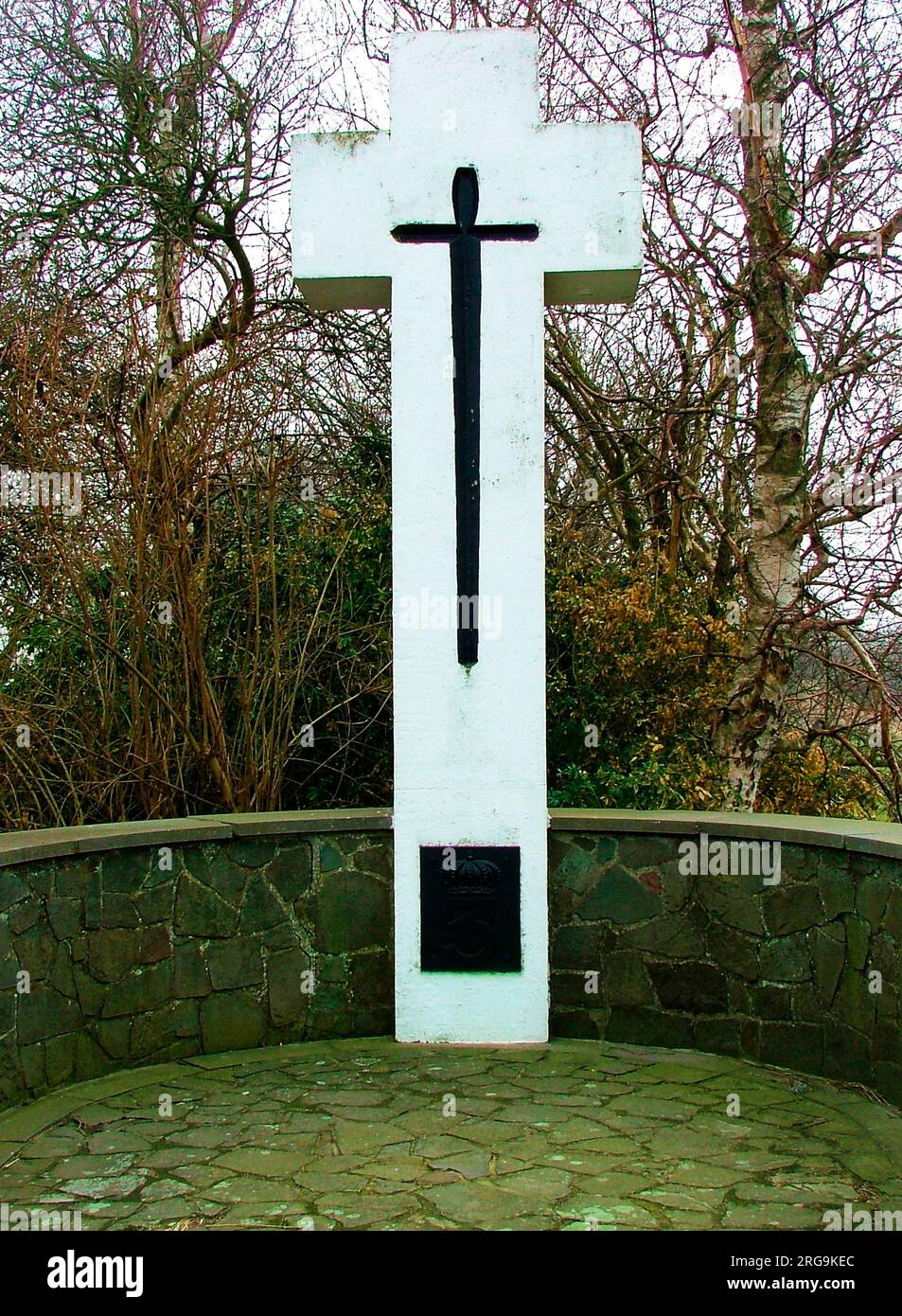 This tall white cross, surmounted with a Crusaders sword, is a memorial ...
