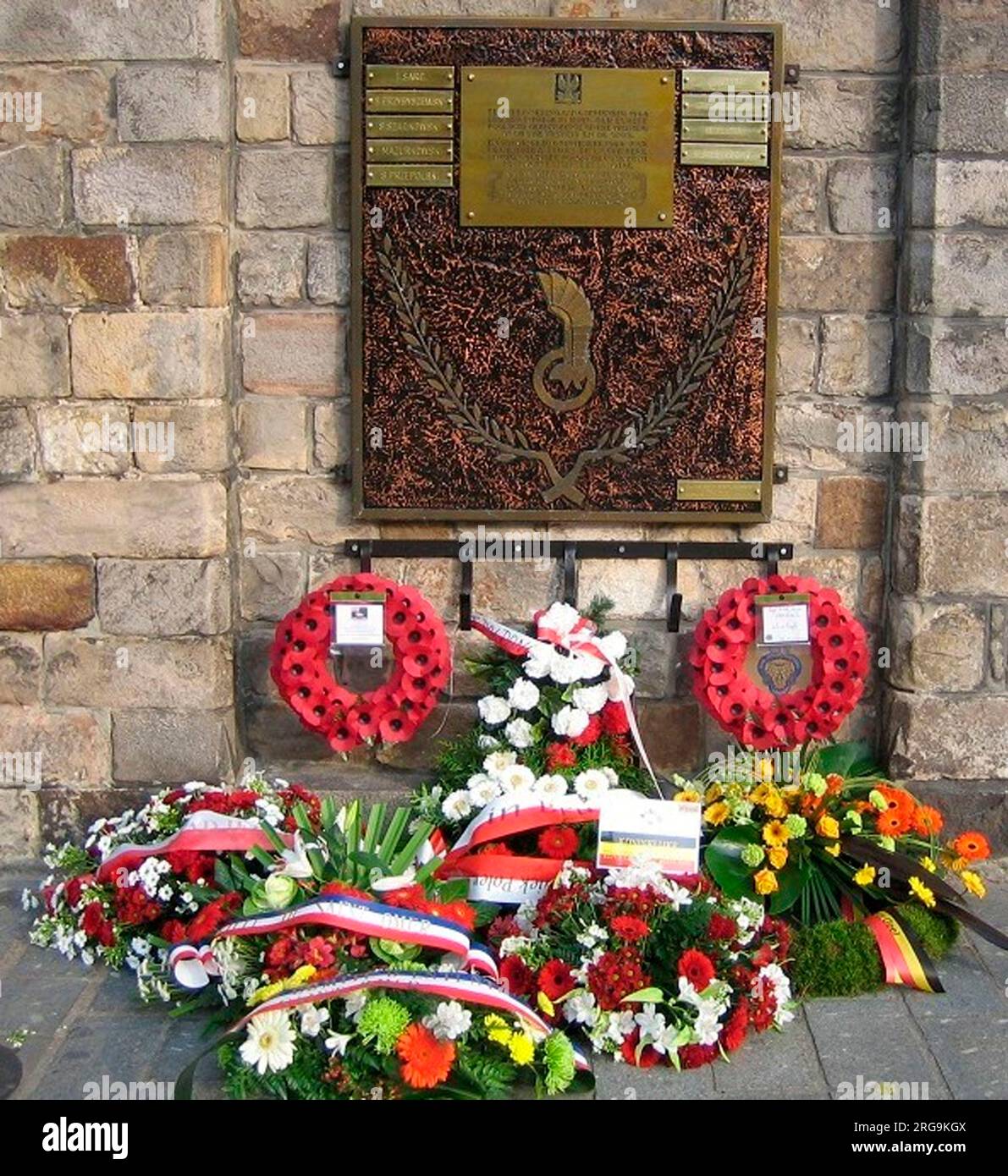 The memorial, which is on an outside wall, commemorates the Polish ...