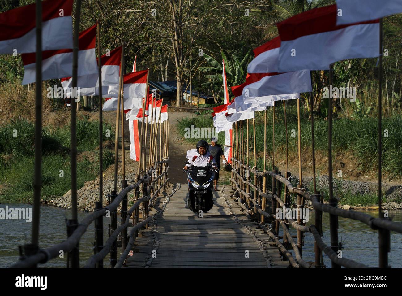 Bantul, Yogyakarta, Indonesia. 8th Aug, 2023. A motorcyclist crosses a ...