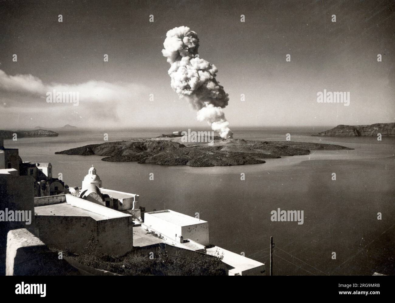 Santorini, Greece - view across the volcano crater, with smoke issuing ...
