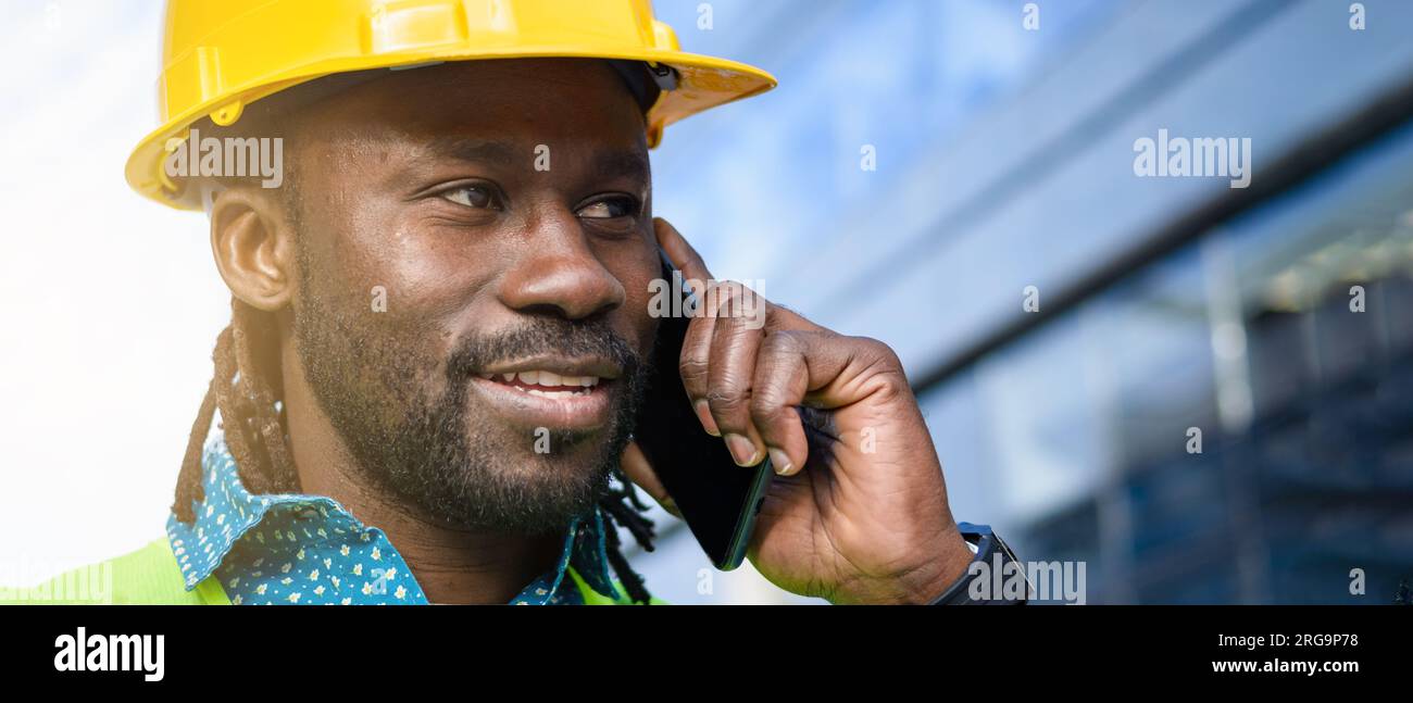 closeup banner of black engineer man with beard, dreadlocks and is ...