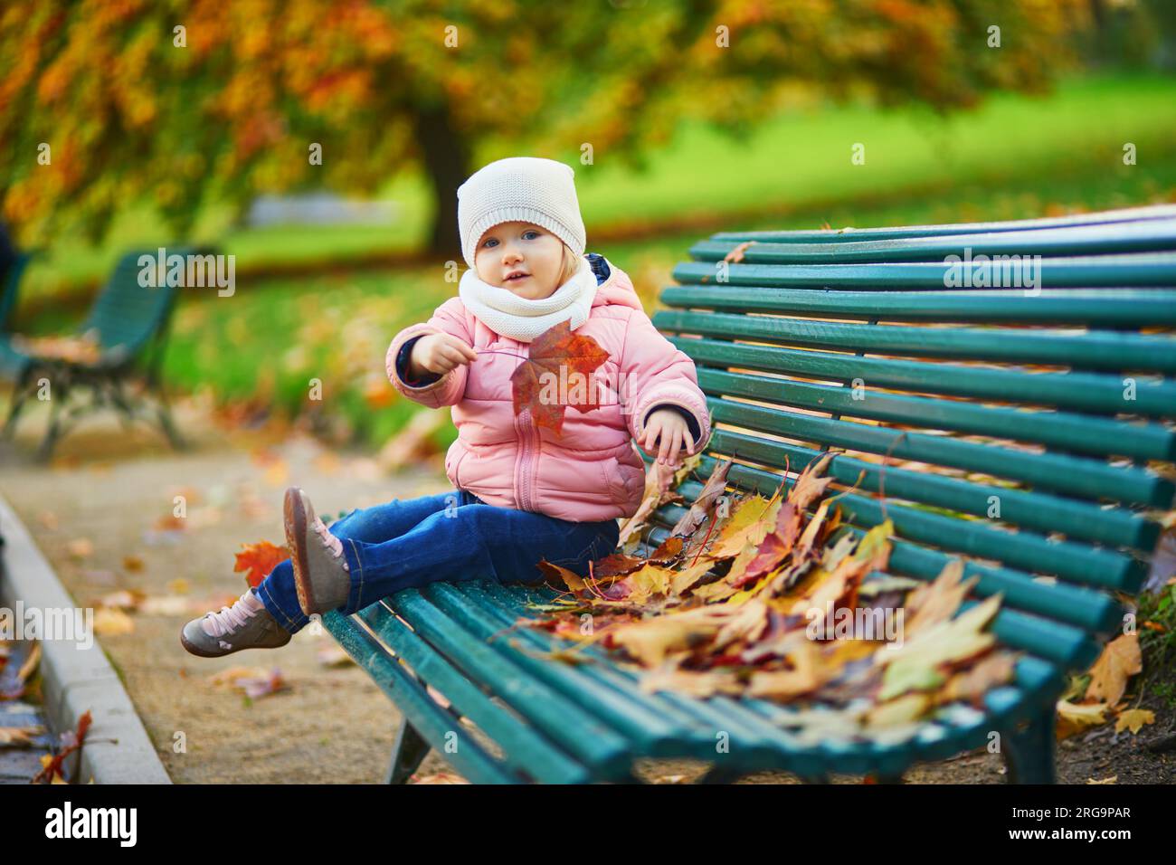 Children playing on a park bench hi-res stock photography and images ...