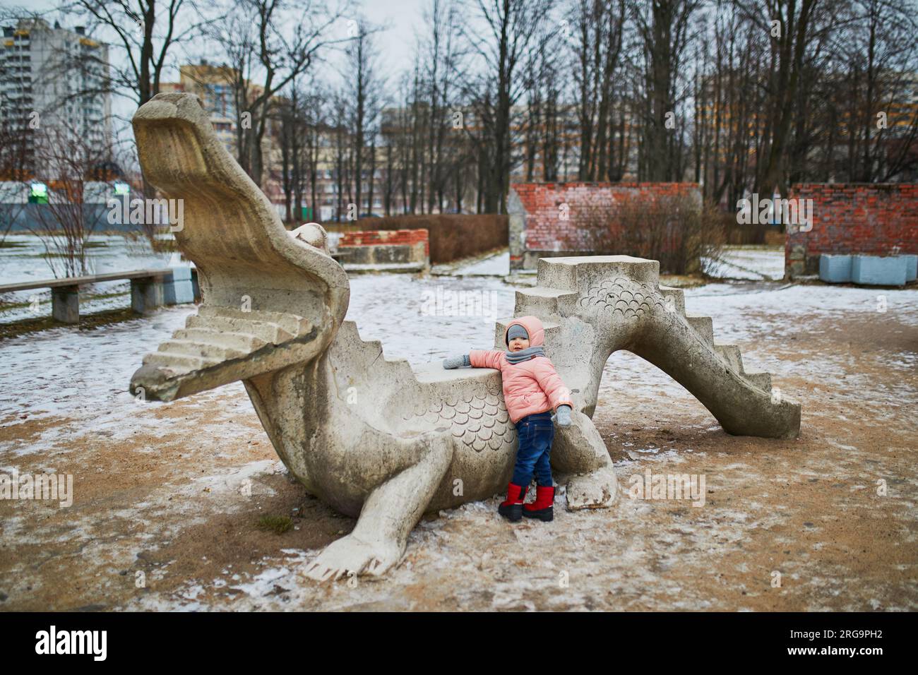 Adorable little toddler girl in park on a spring or winter day. Child ...