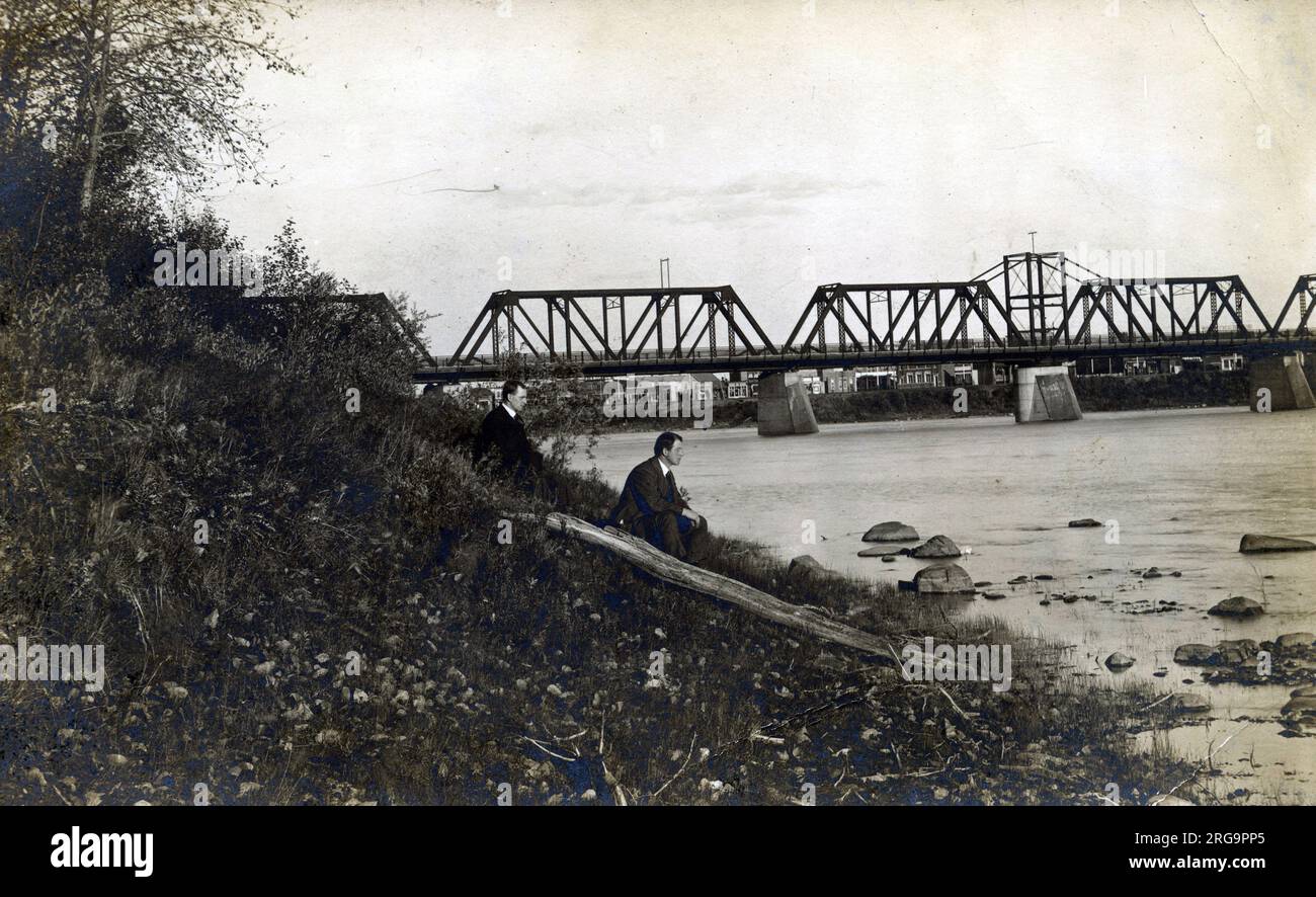 Saskatchewan River bridge - The Pas Manitoba with man on riverbank ...