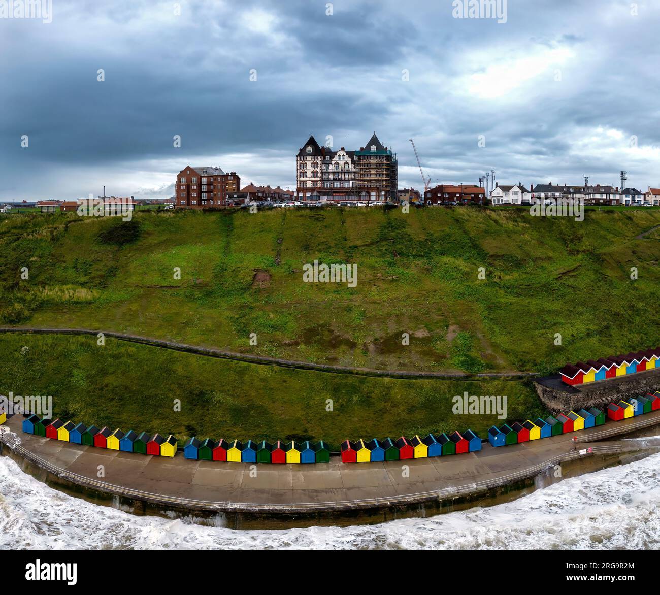 An aerial view of the colourful beach huts along the sea front in ...
