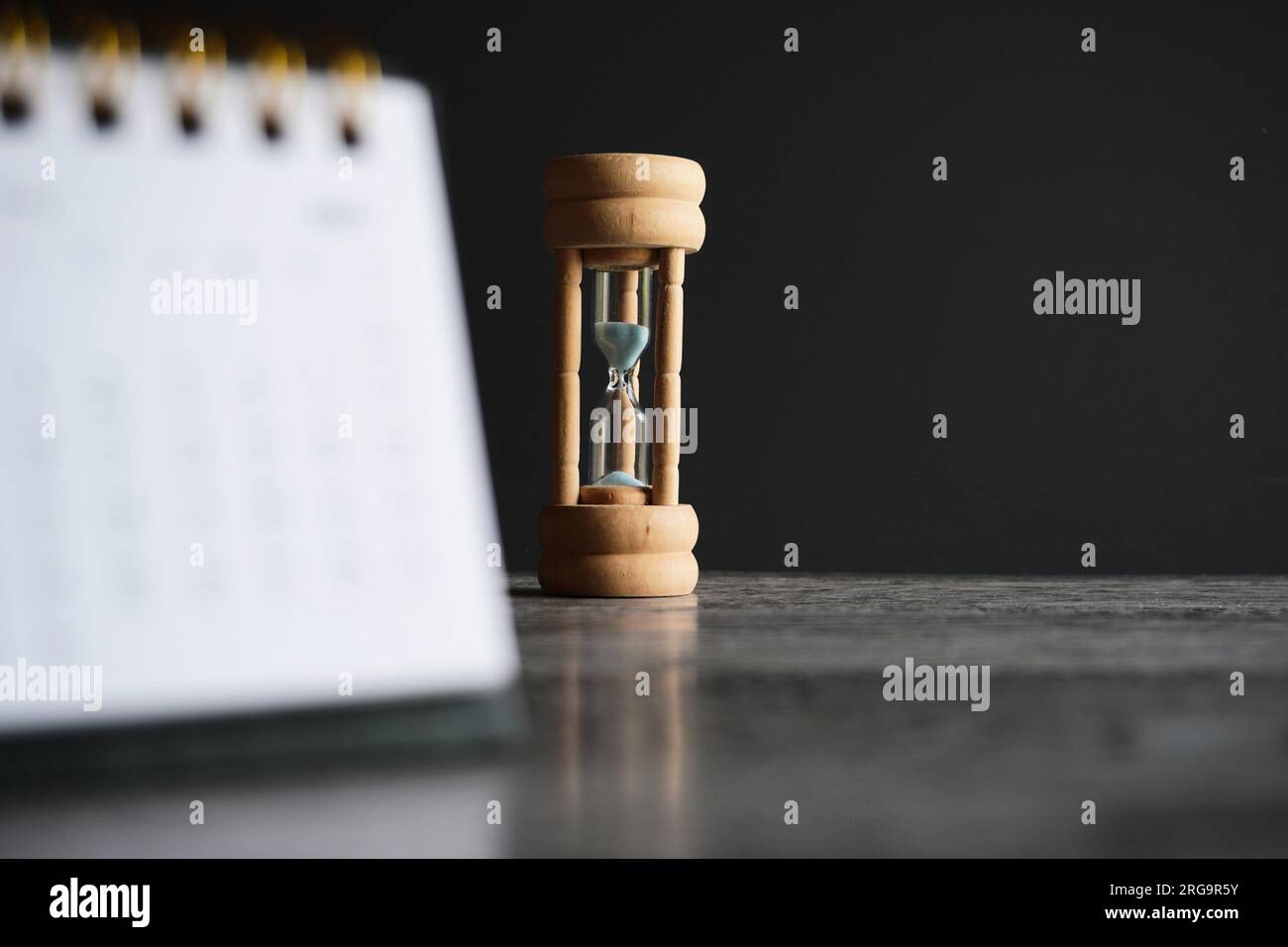 Close up image of calendar and hourglass with copy space. Deadline ...