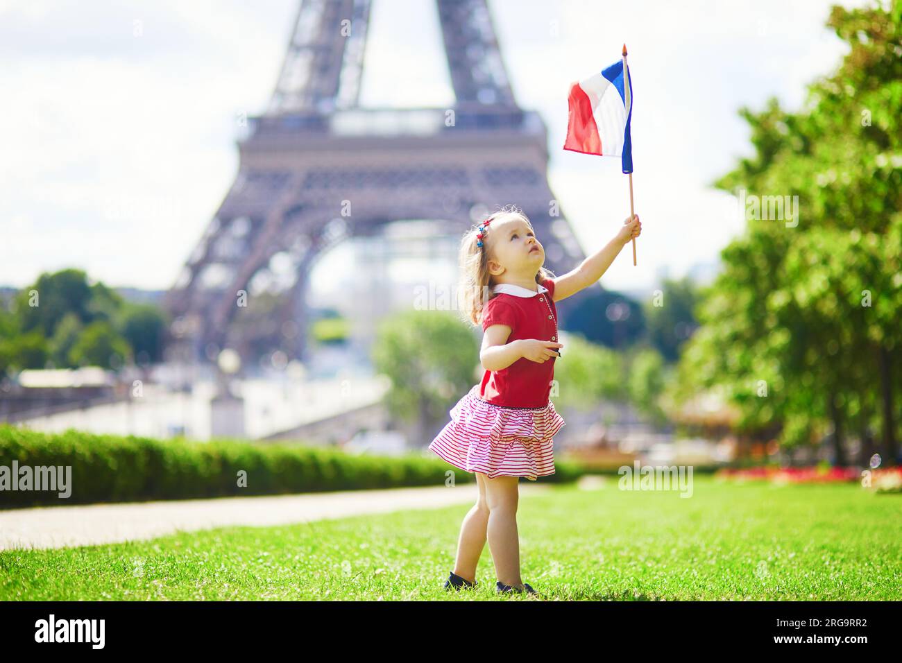 Beautiful toddler girl with French national tricolor flag near the ...