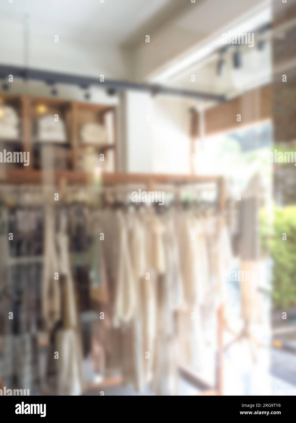 Abstract blurred modern clothes shop interior background, vertical ...