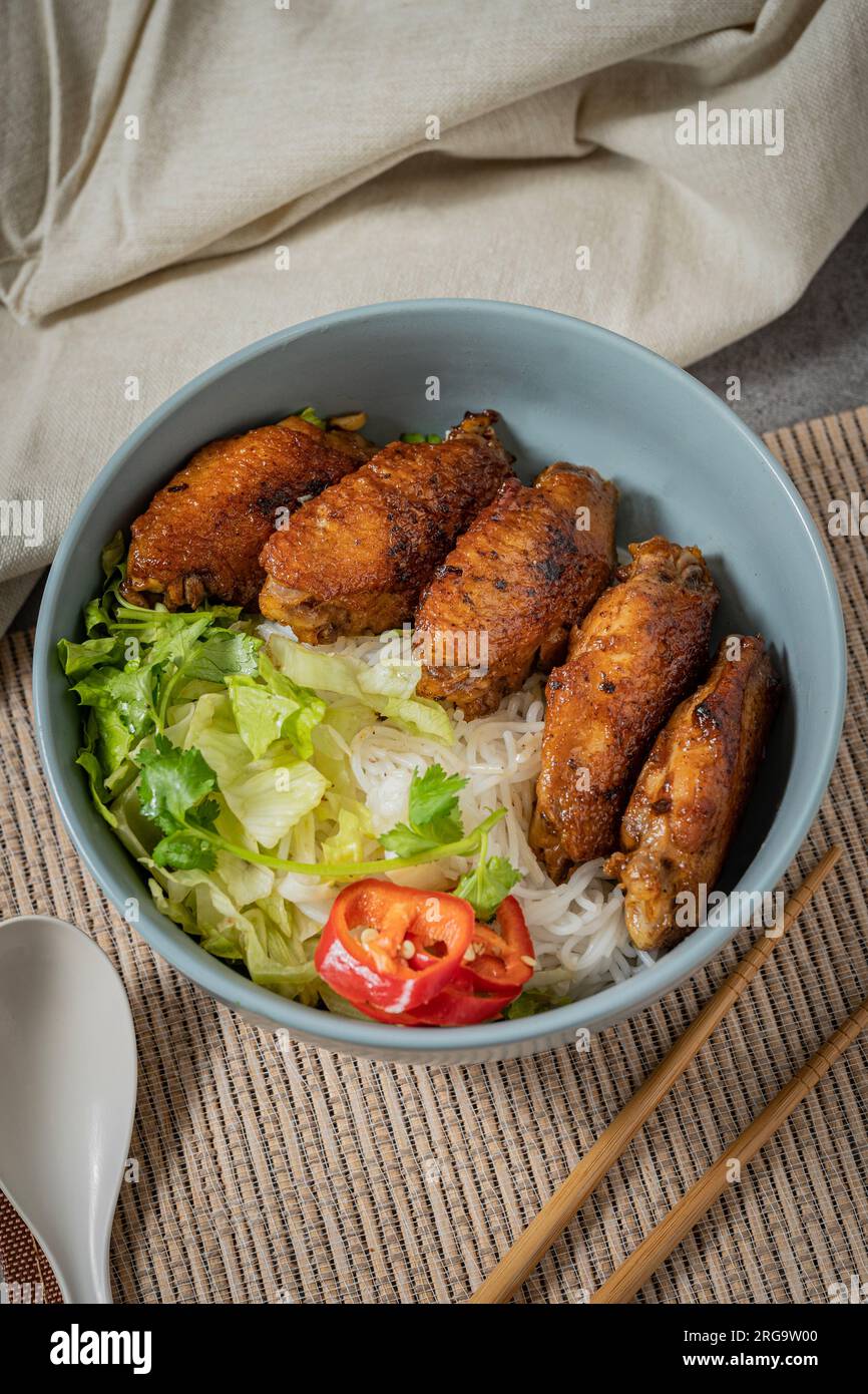 Vietnamese Mixian served with chicken wings Stock Photo - Alamy