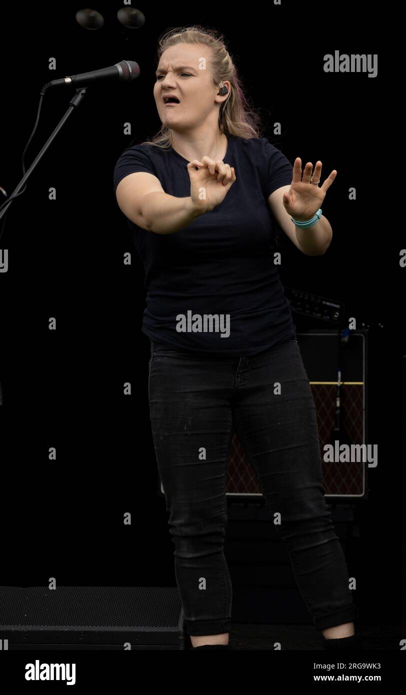 A woman signing for the deaf alongside singing at Art in the Park ...
