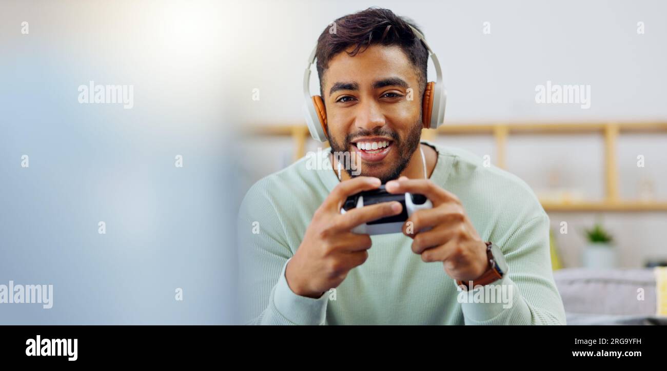 Gaming, winner and esports with a man in the living room of his home ...