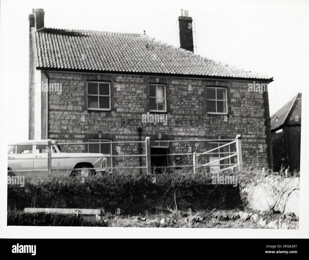 Photograph of New Inn, Axminster, Somerset. The main side of the print ...