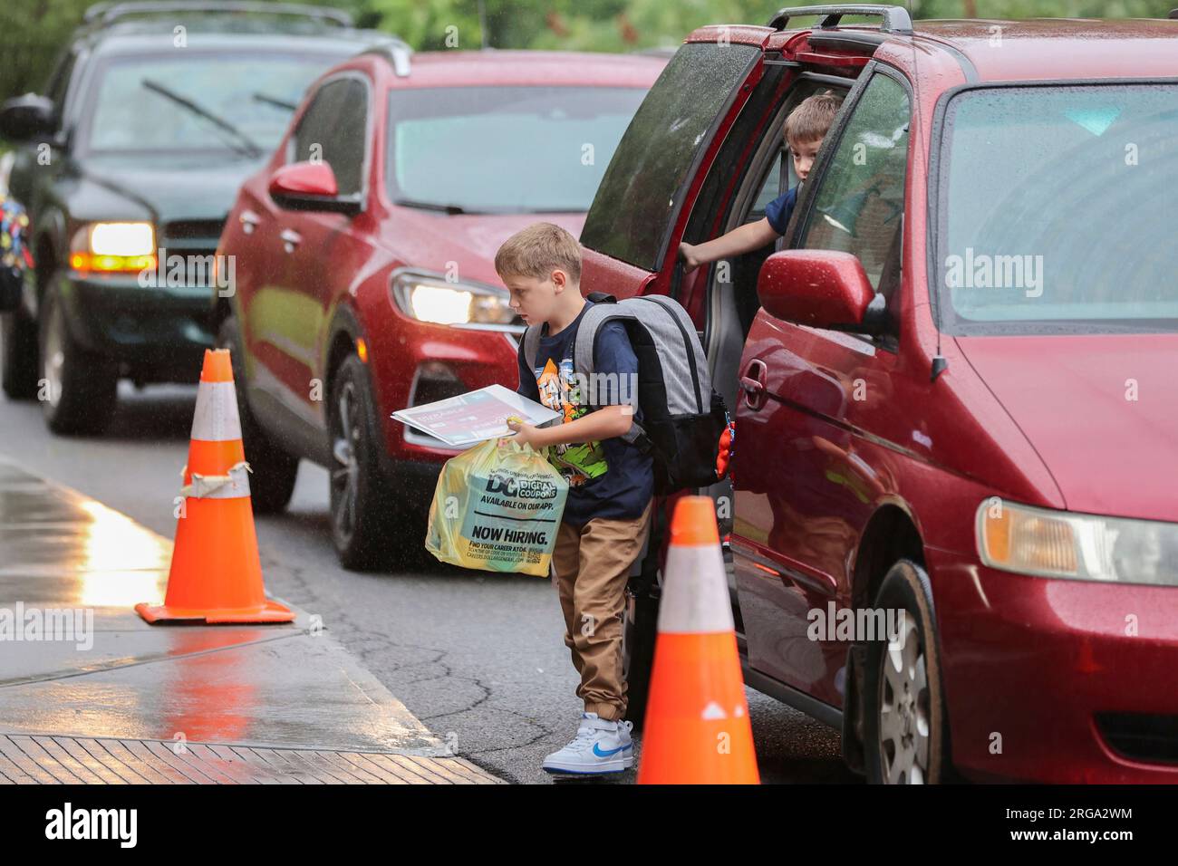 Jacob and Landon Kennedy hop out of their vehicle as they walk to the ...