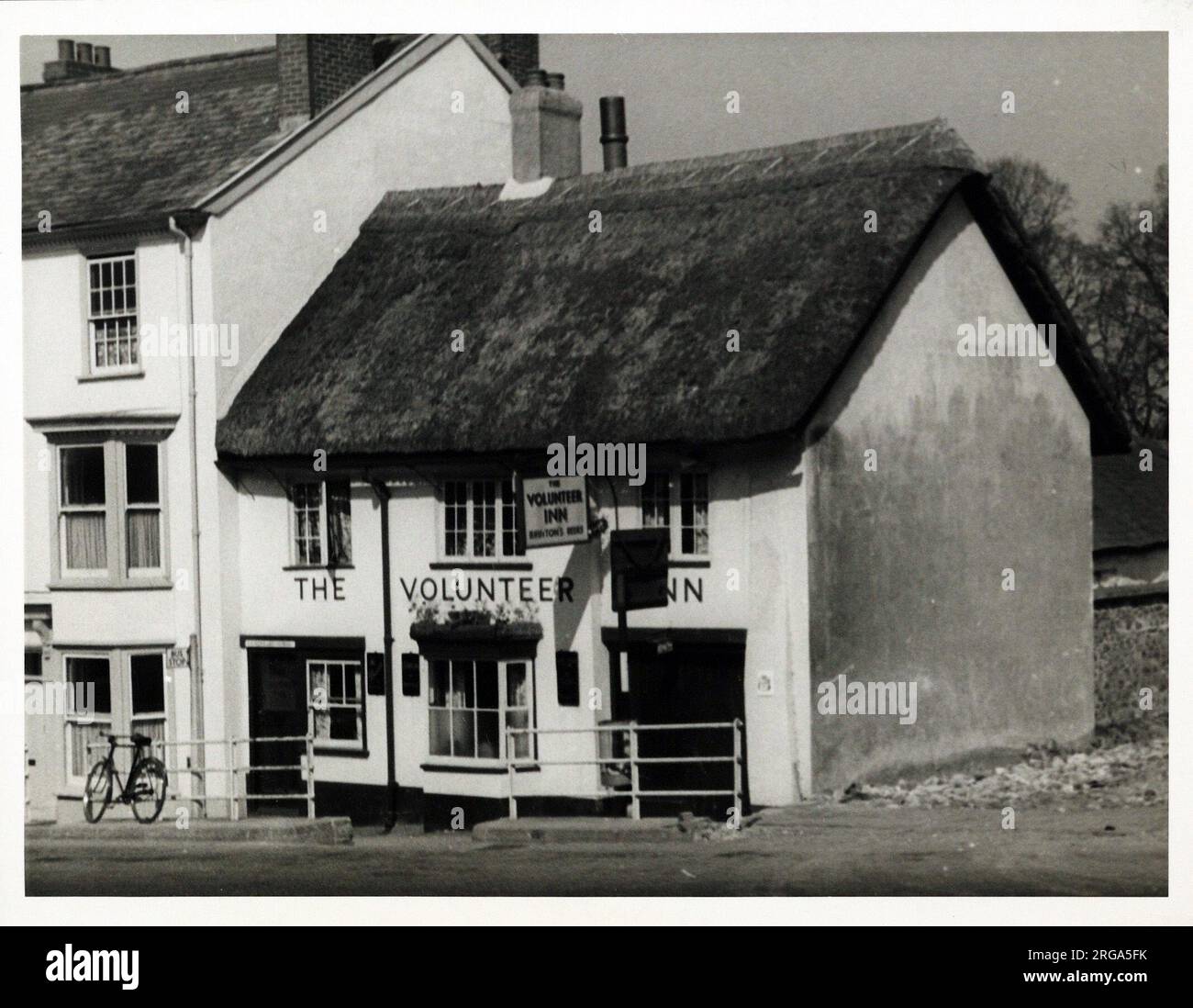 Photograph of Volunteer Inn, Honiton, Devon. The main side of the print ...