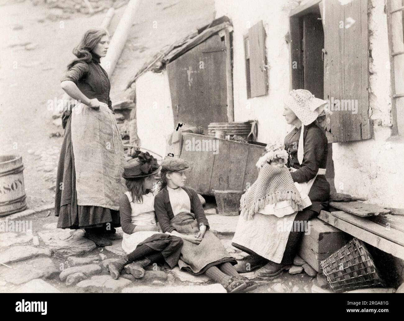 Fishing family outside their cottage, Staithes, Yorkshire. Vintage 19th ...