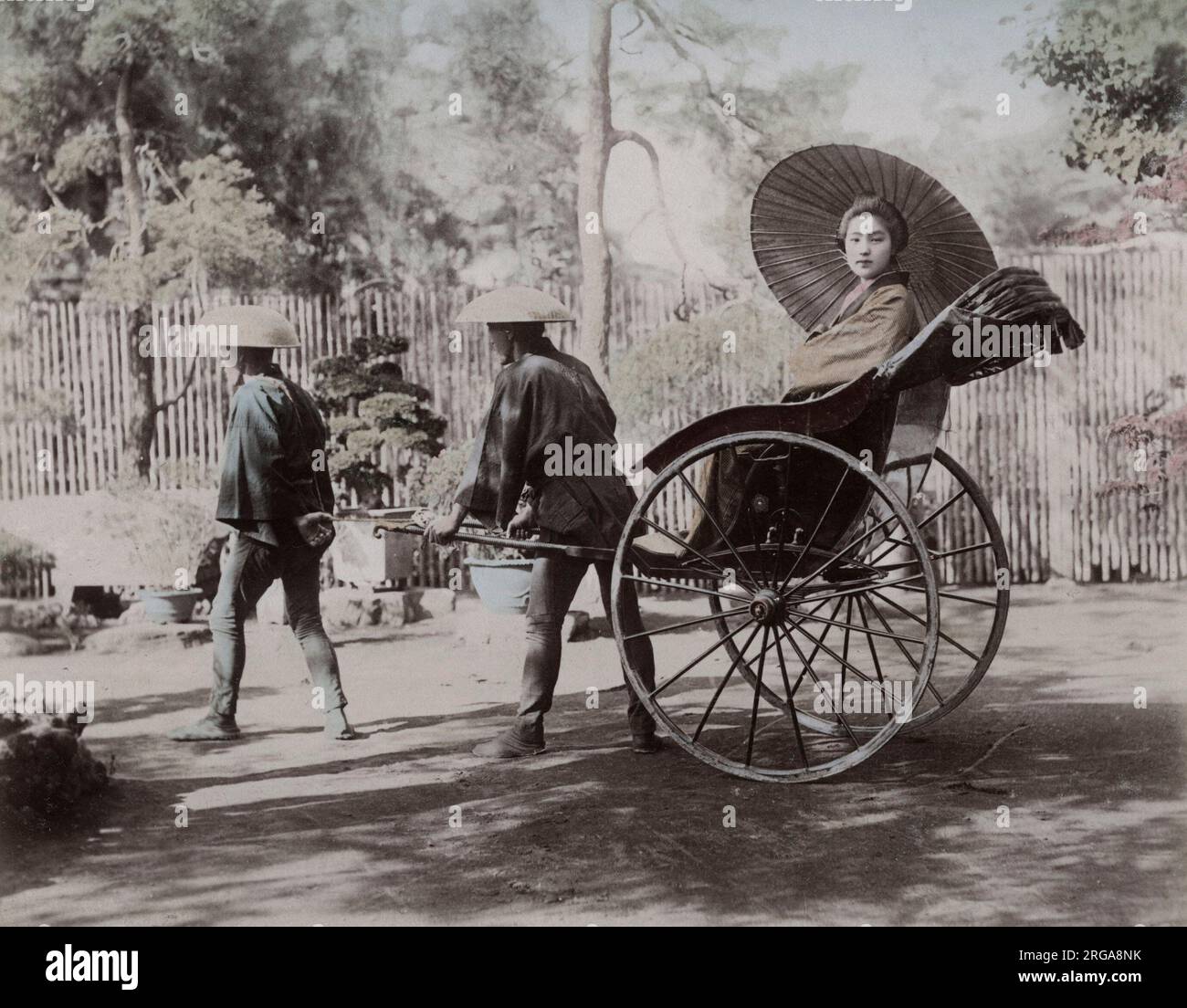 Young woman being pulled in a rickshaw, Japan. Vintage 19th century ...