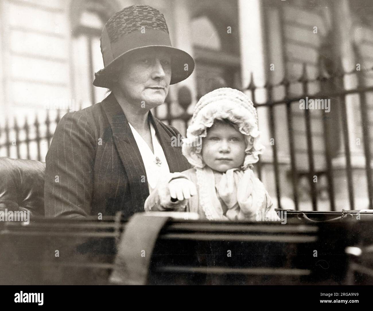 Her Majesty Queen Elizabeth II as a baby in her pram, with nanny Stock ...
