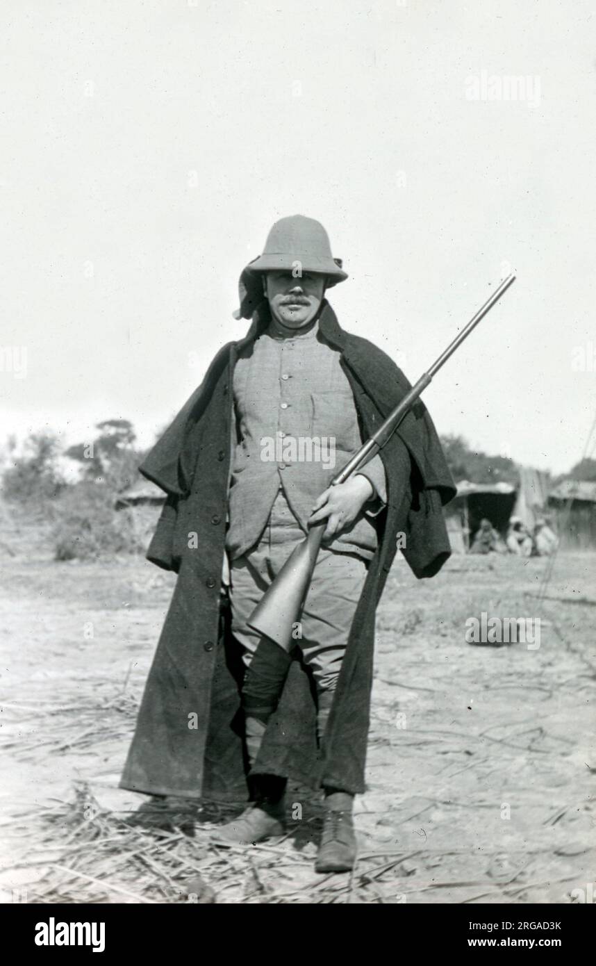 Colonial British gent in Indian hunting party, posing with rifle Stock ...