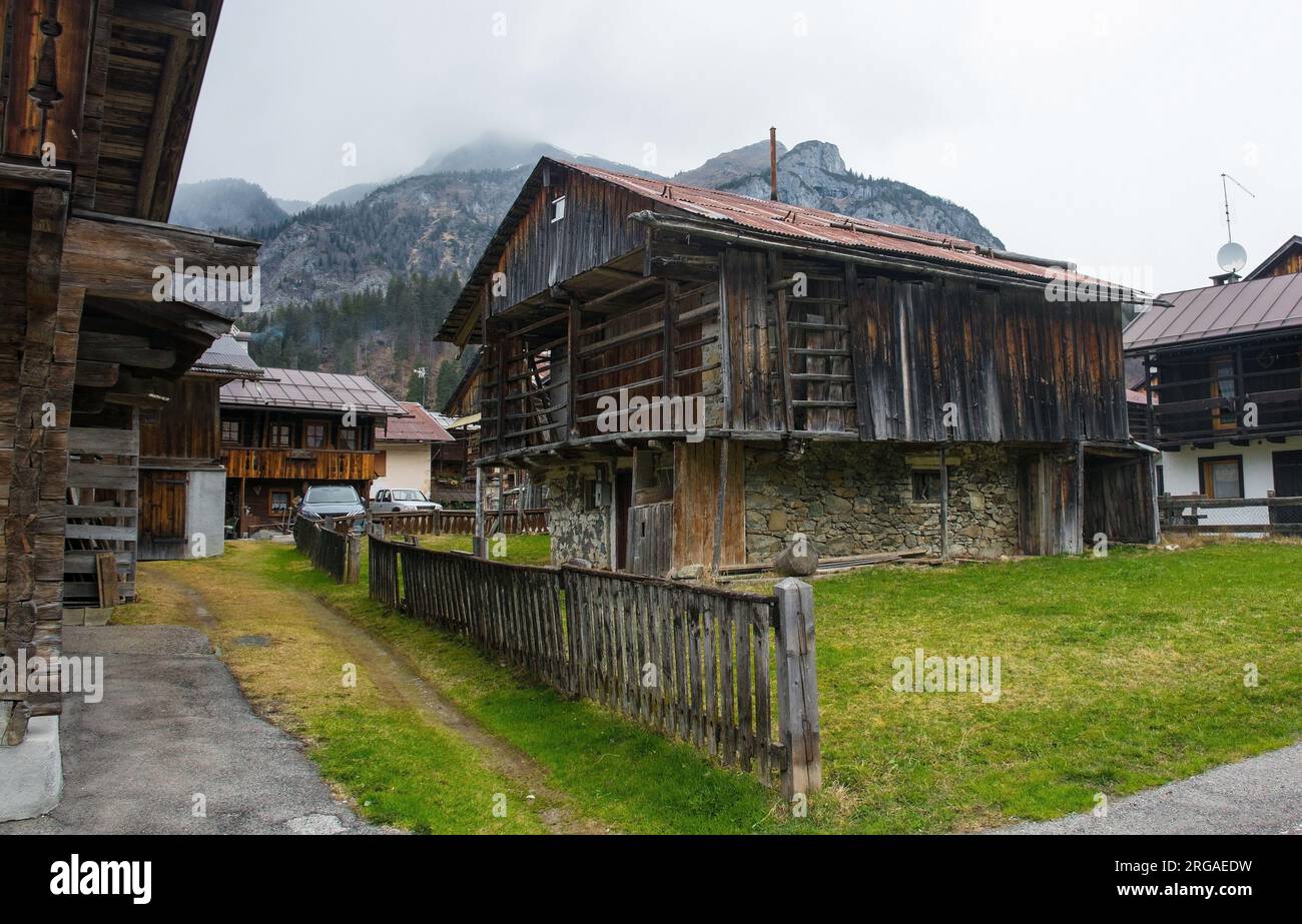Traditional wooden houses in the historic mountain village of Cima ...