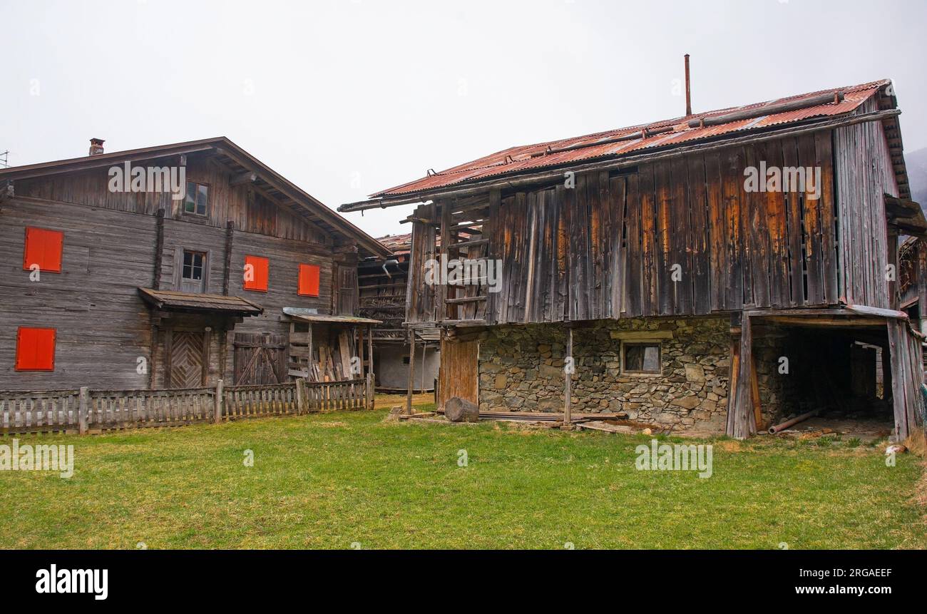 Traditional wooden houses in the historic mountain village of Cima ...
