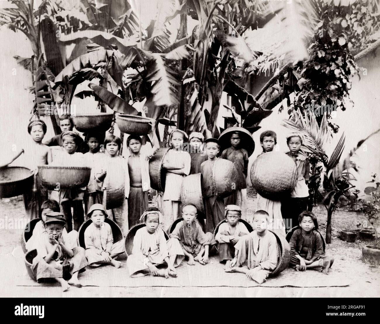 19th century vintage photograph: Annamite porters with baskets ...
