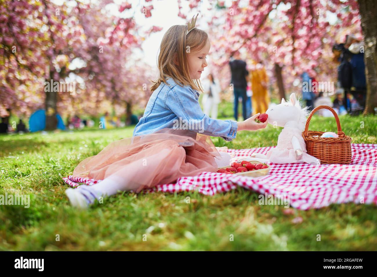 Adorable preschooler girl in tutu skirt and princess crown enjoying ...