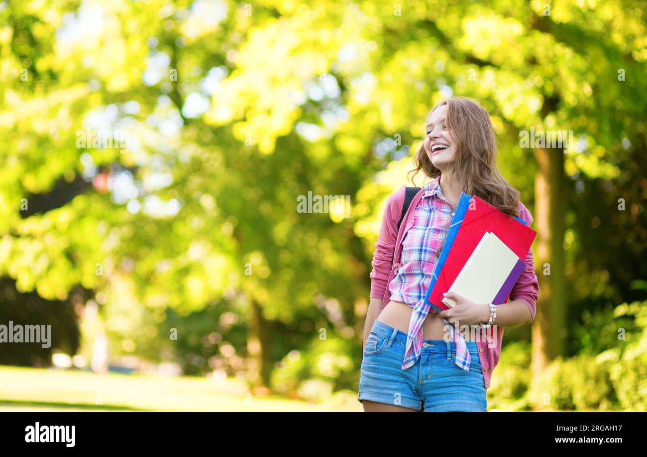 College student with books and folders Stock Photo - Alamy
