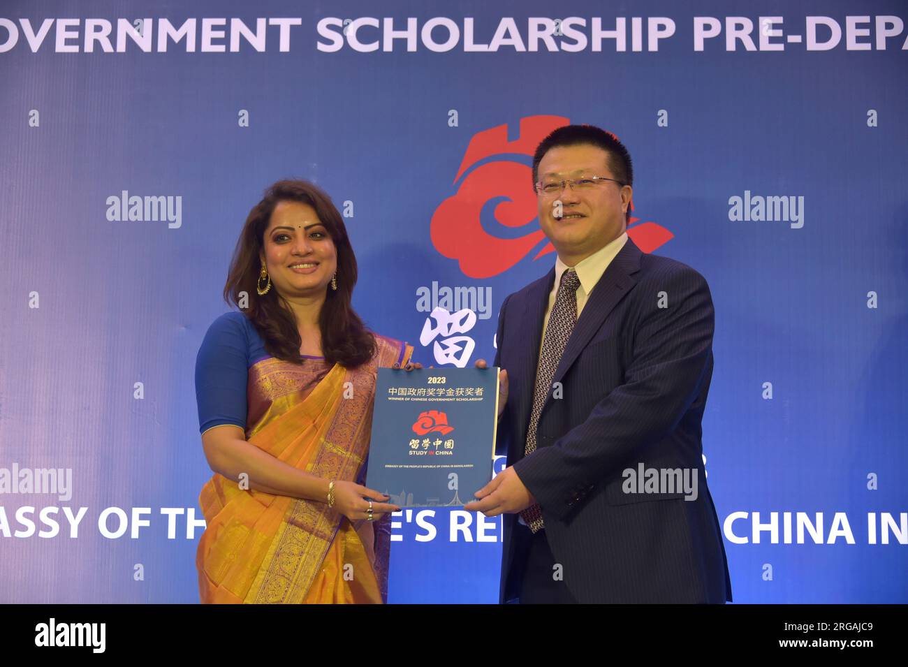 Dhaka. 8th Aug, 2023. A scholarship recipient receives offer letter ...