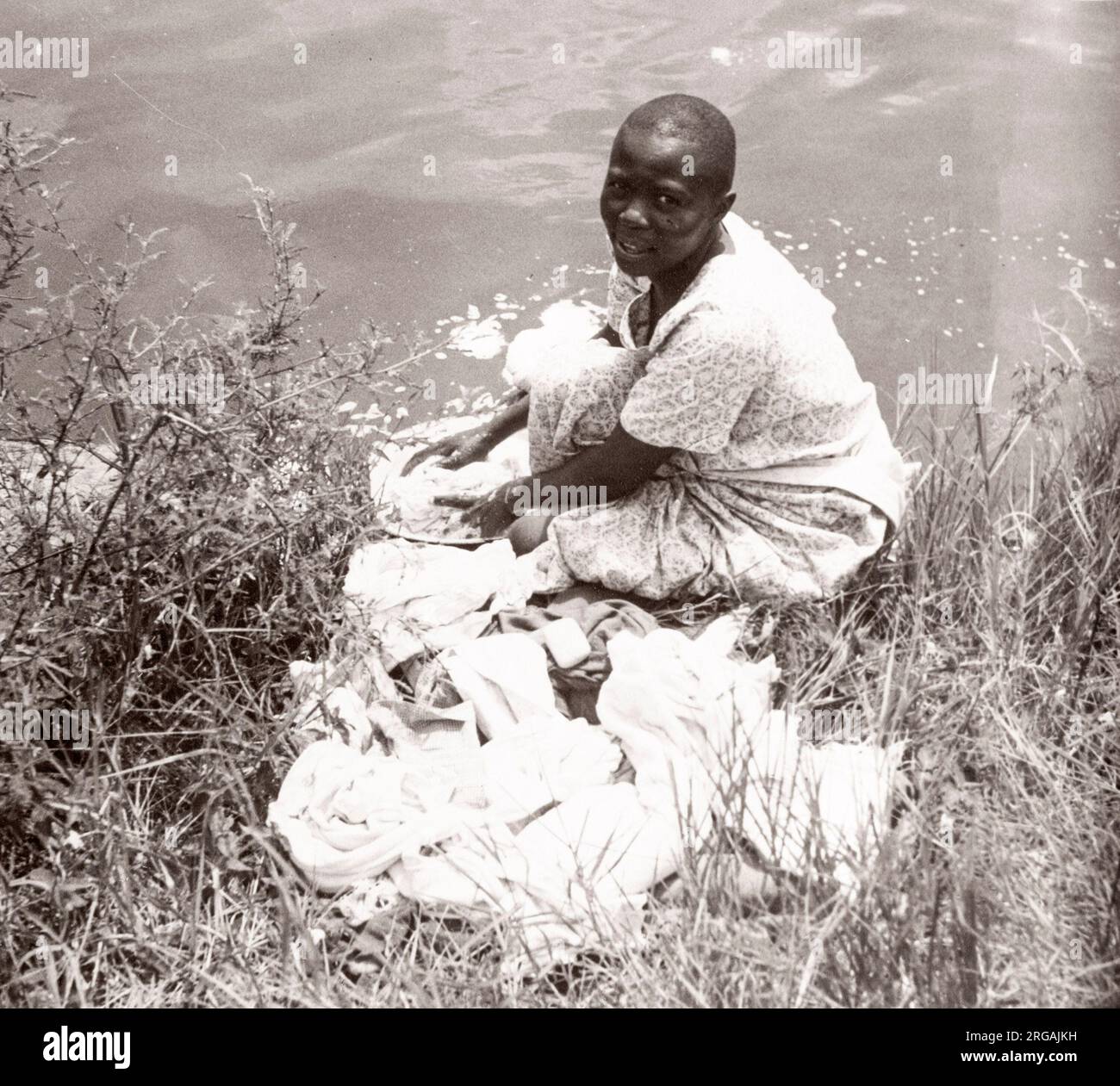 1940s East Africa - Uganda - Baganda women washing clothes Lake ...