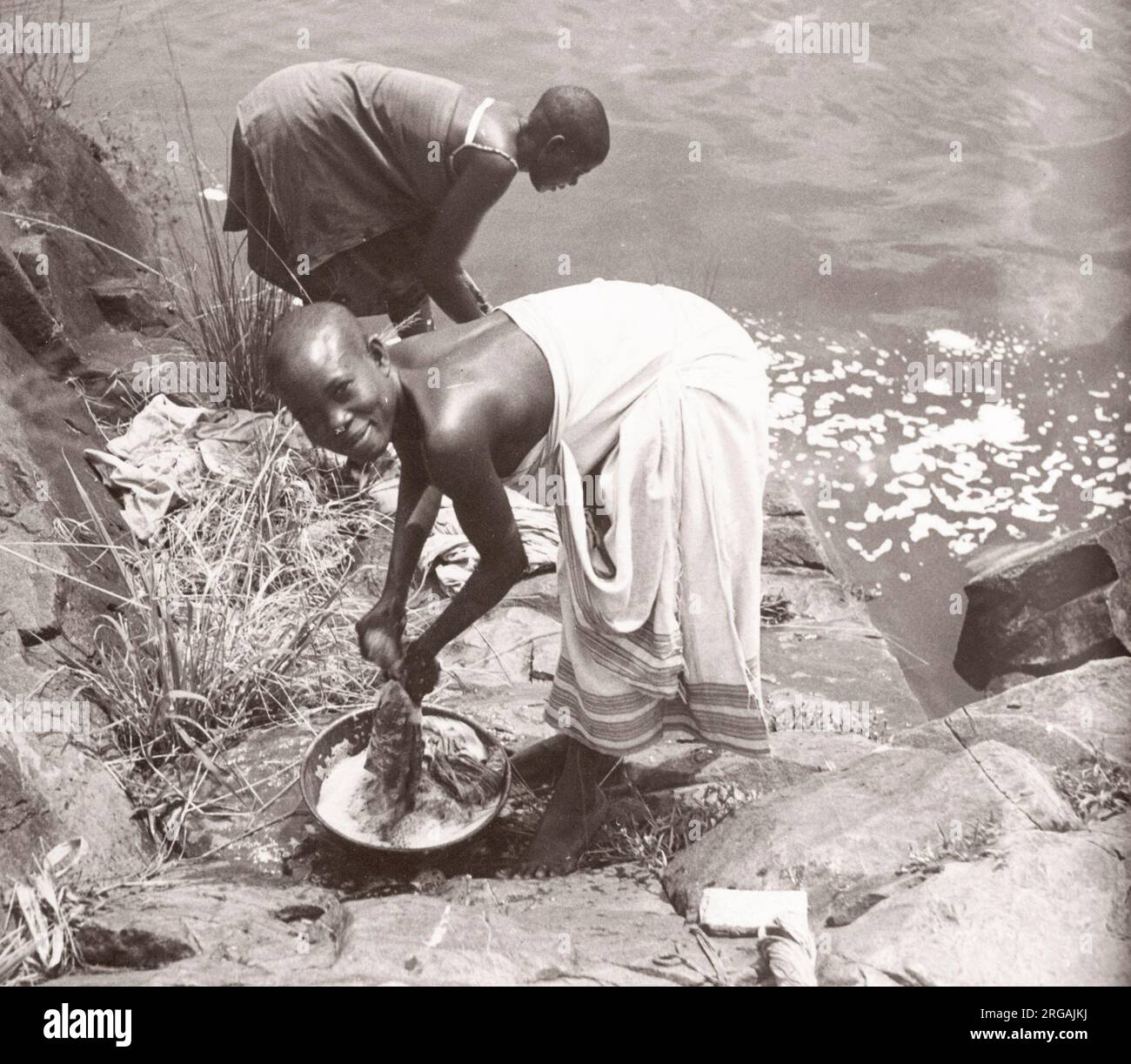 1940s East Africa - Uganda - Baganda women washing clothes Lake ...