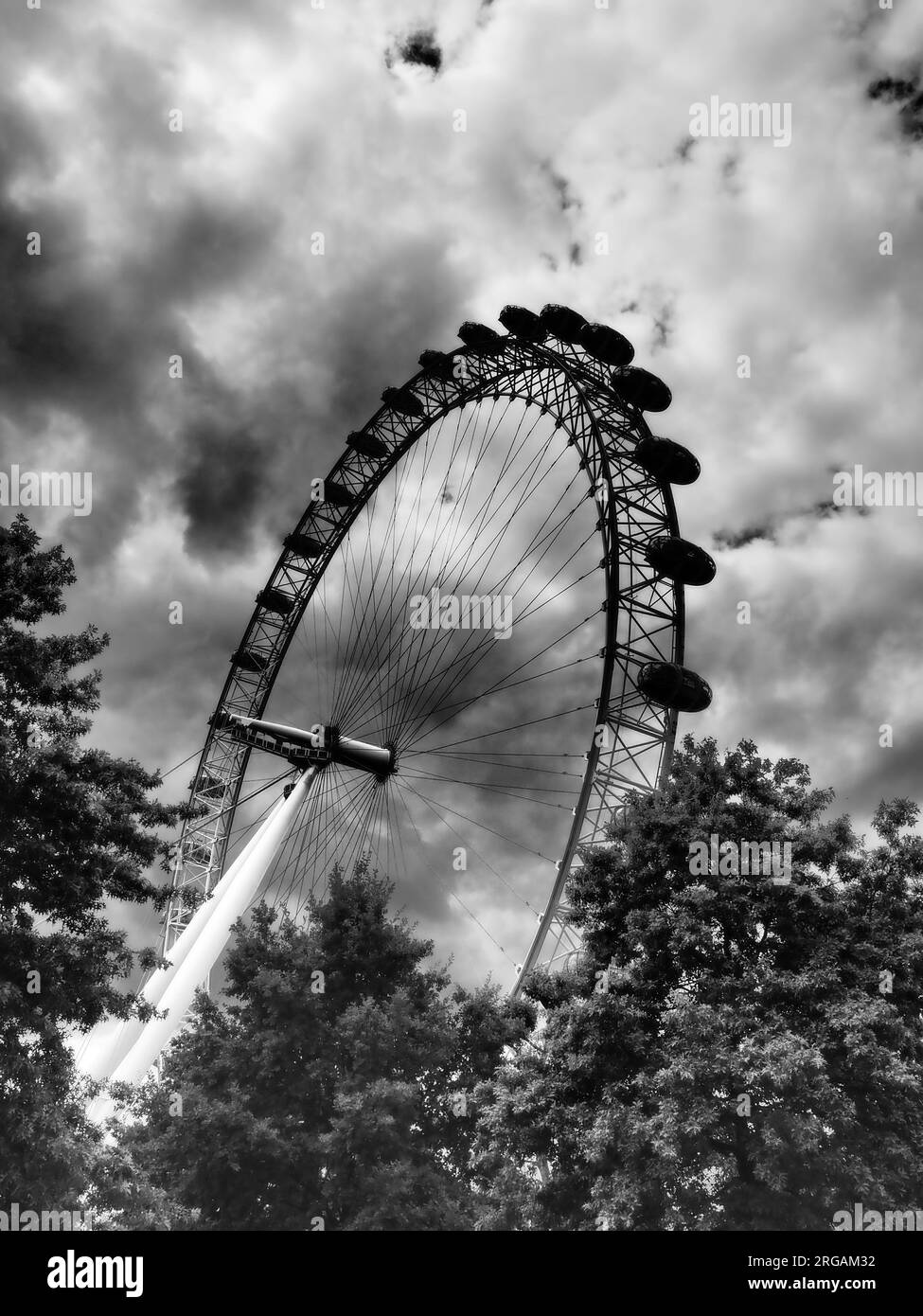 A dramatic high contrast picture of London Eye against a stormy sky in ...