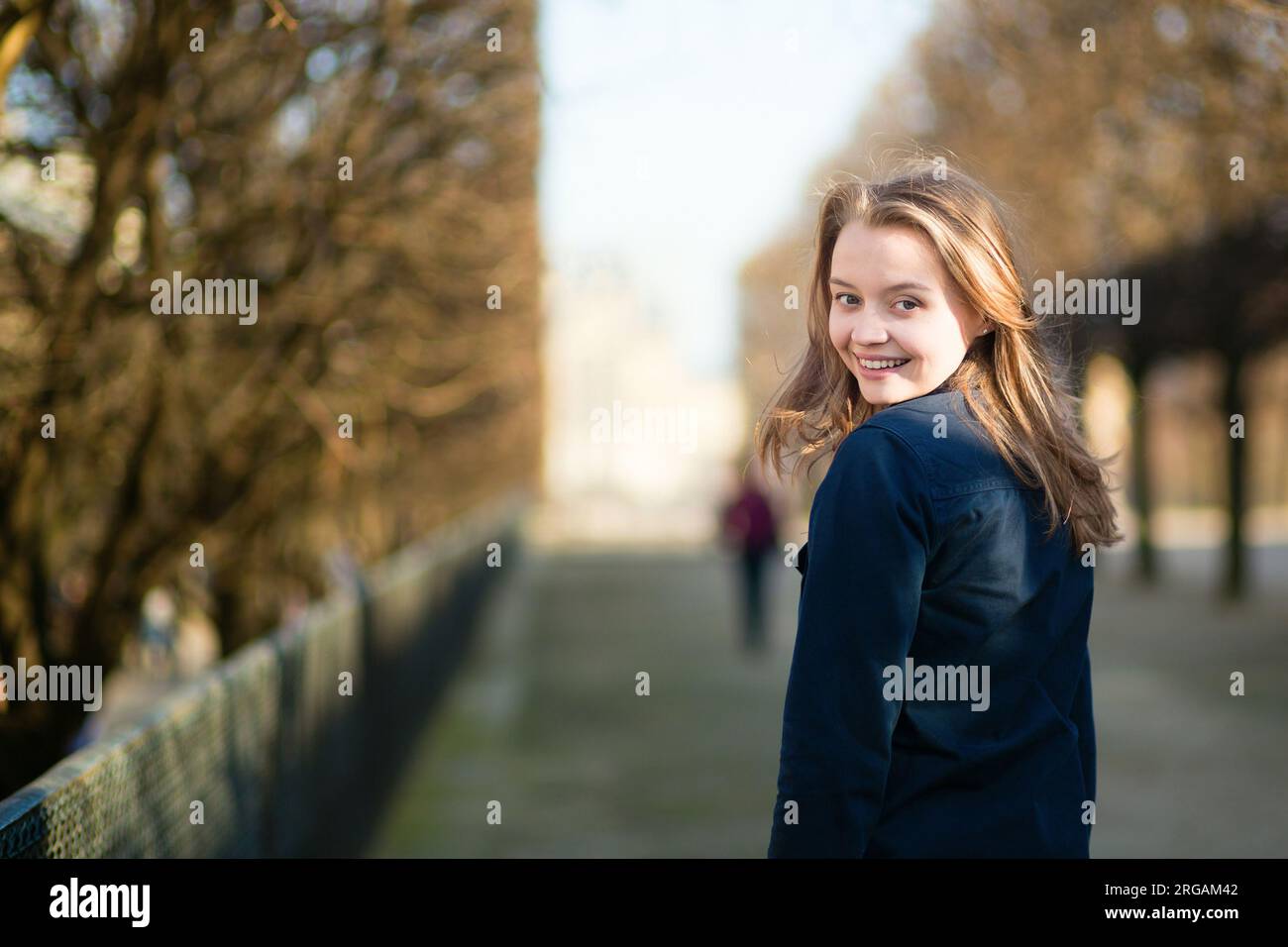 Beautiful young girl outdoors on a spring day Stock Photo - Alamy