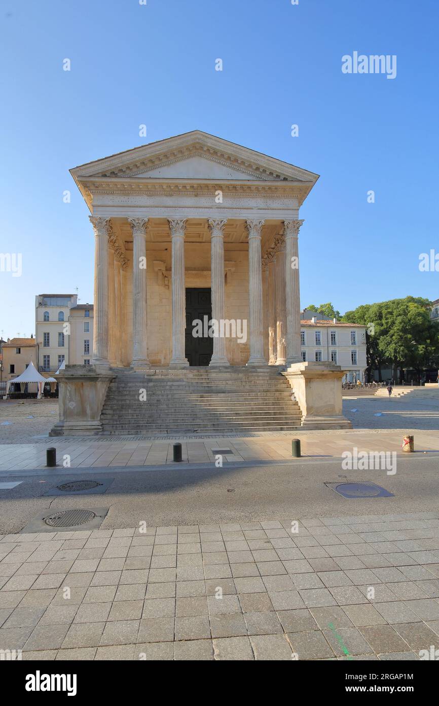 Ancient Roman UNESCO podium temple Maison Carrée with columns, Nîmes ...