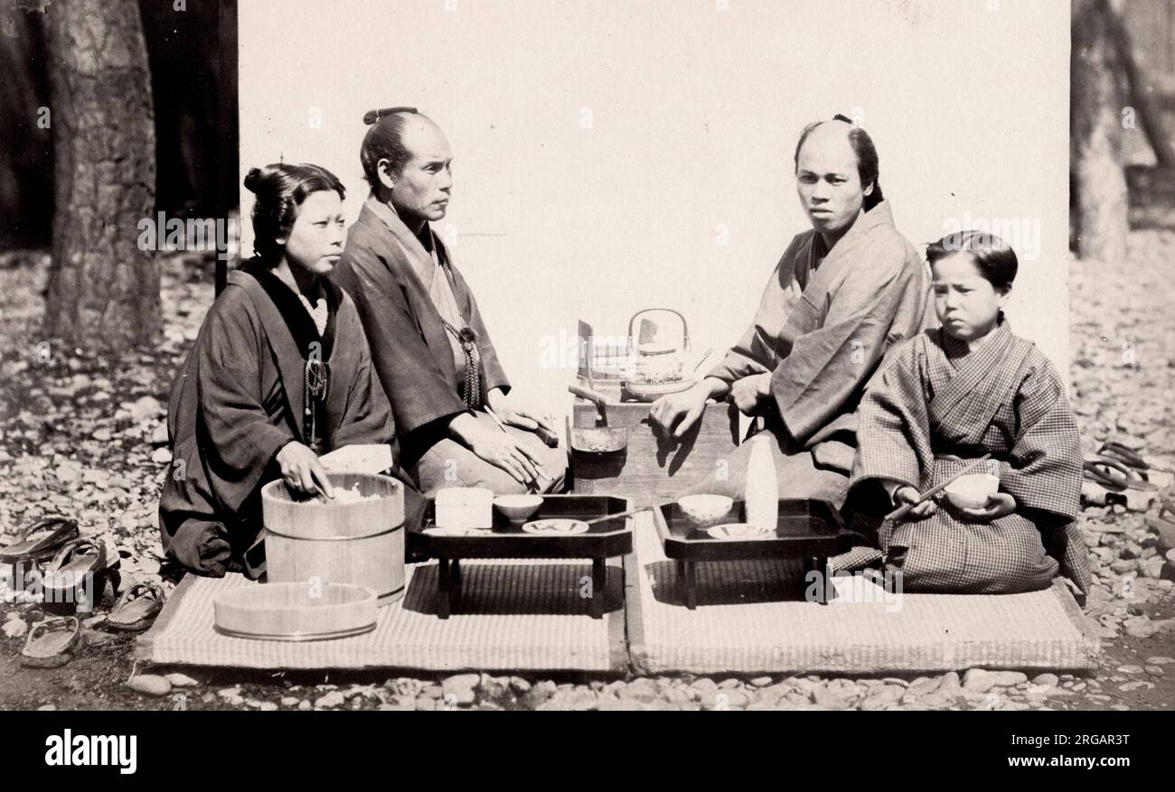 Vintage late 19th century photograph: Japanese group at a meal, Japan ...