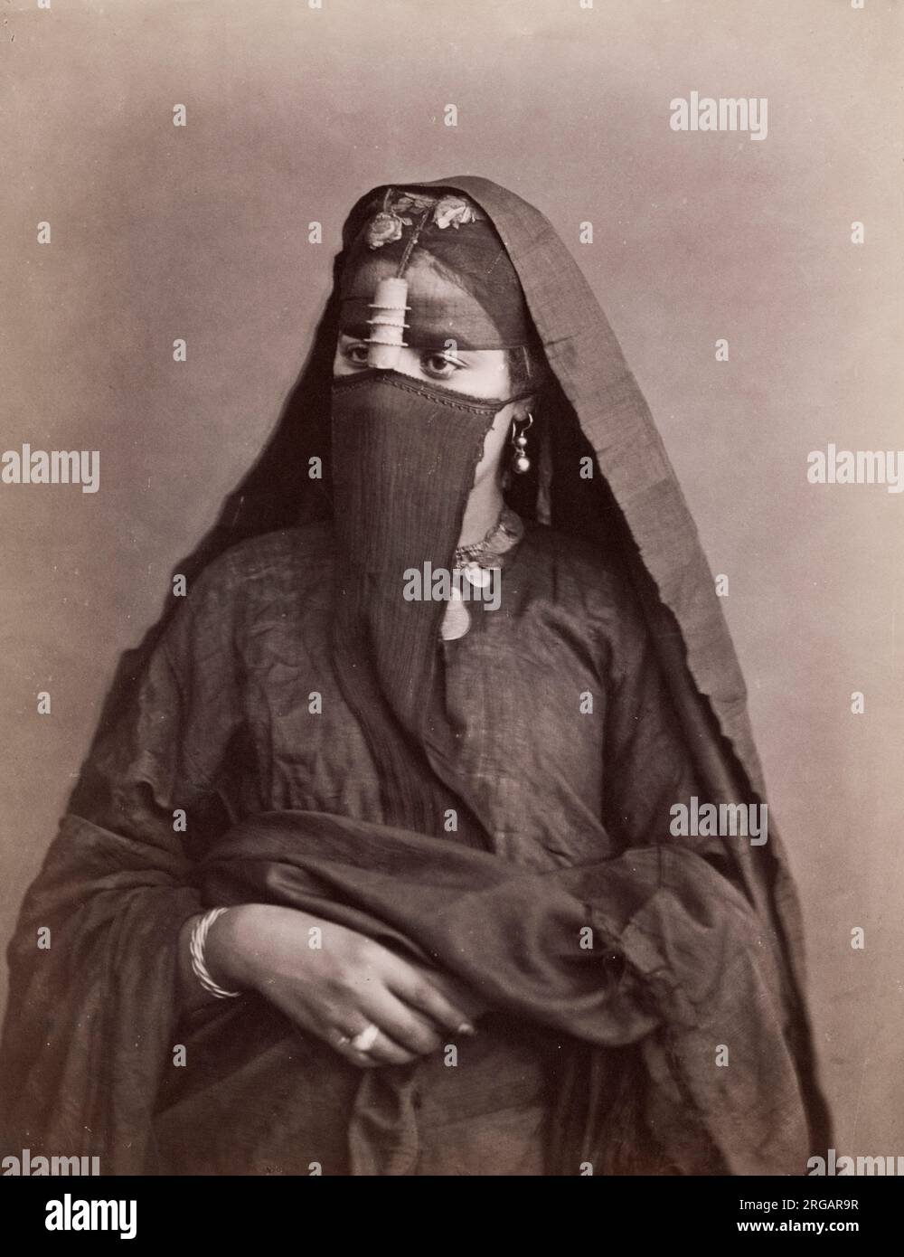 Vintage 19th century photograph - young Arab woman with a face veil ...