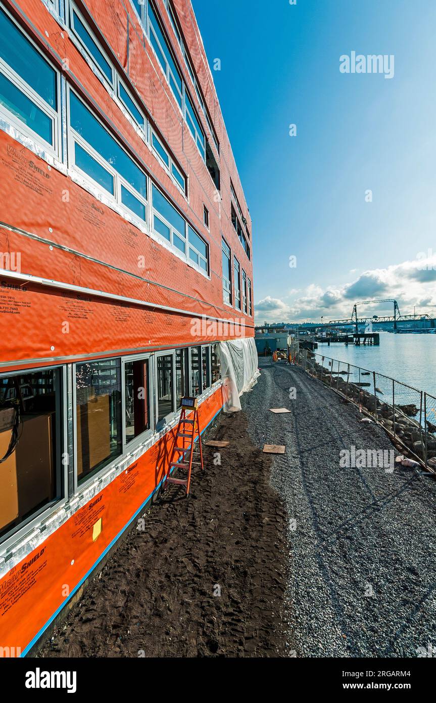 Construction of a commercial building near water Stock Photo - Alamy