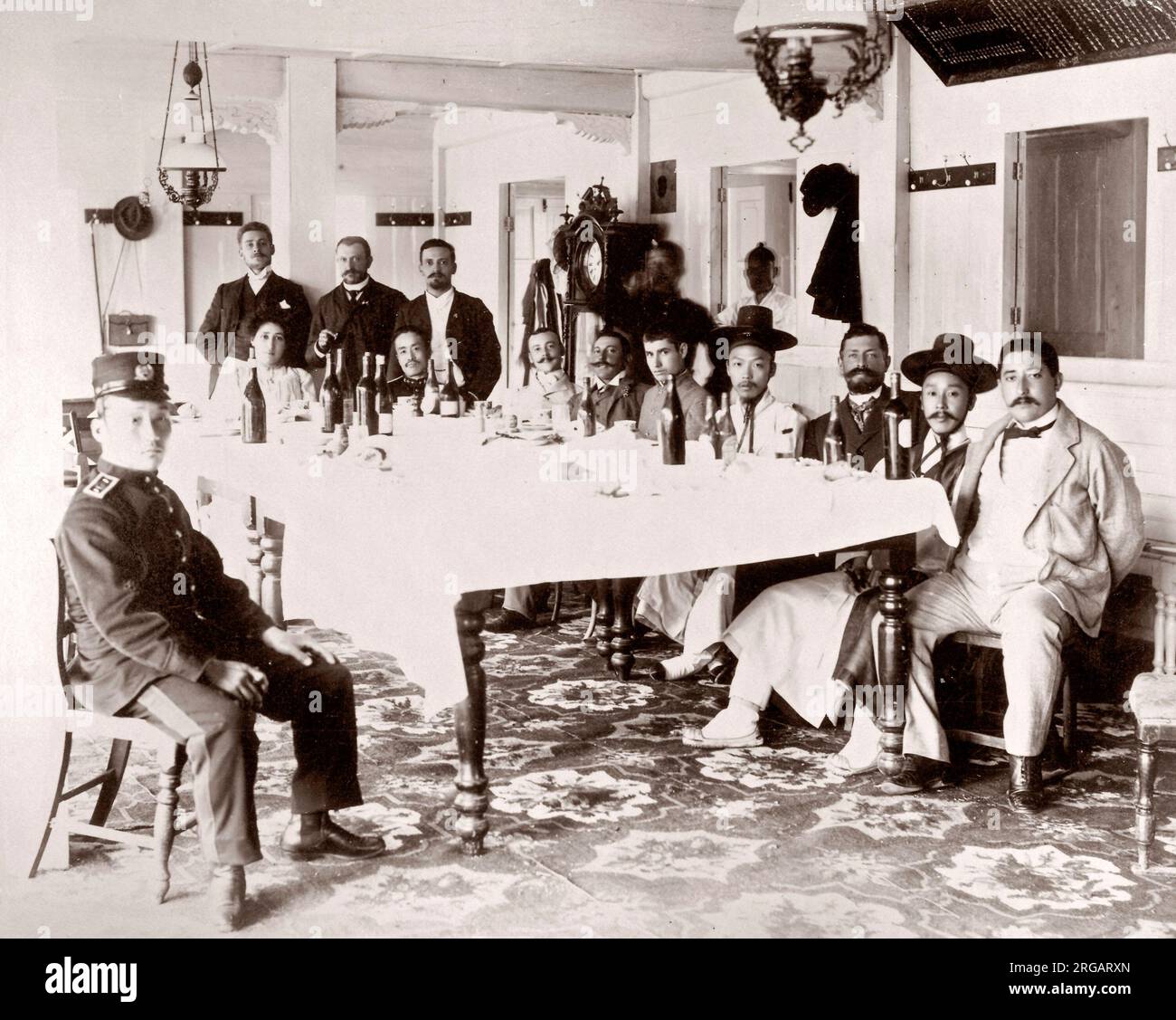 French and Korean businessmen dining together, Seoul, Korea, c.1900 ...