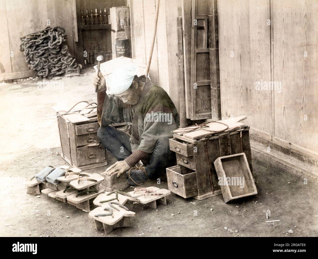 c. 1880s Japan - cobbler / shoe maker at work Stock Photo - Alamy