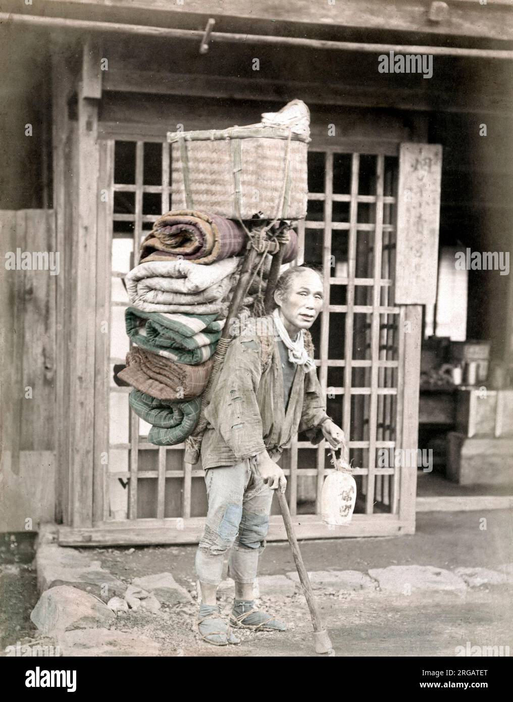 c. 1880s Japan - porter carrying load for pilgrims up Mount Fuji Stock ...