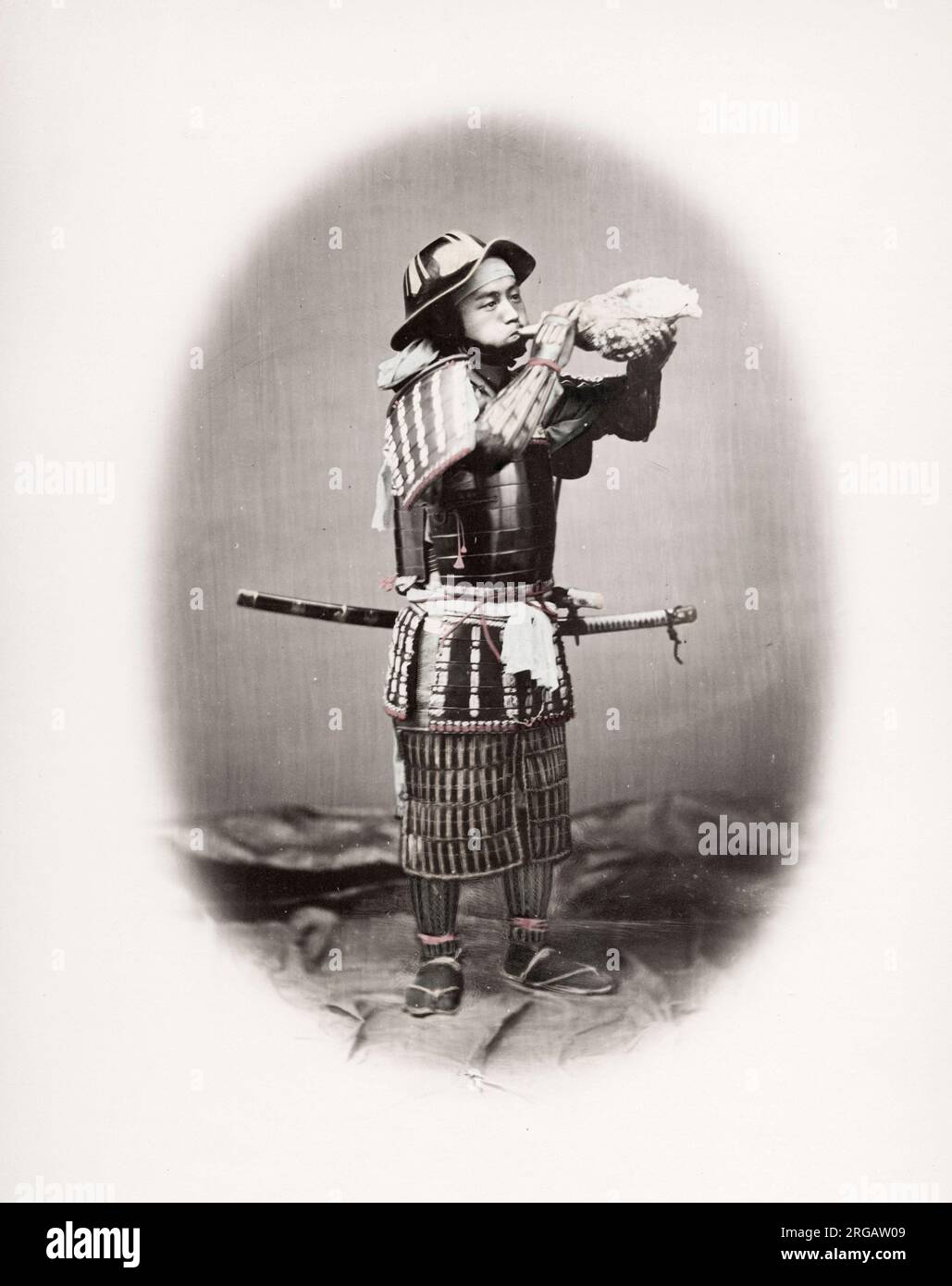 Vintage late 19th century photograph: Samurai in armour with conch ...