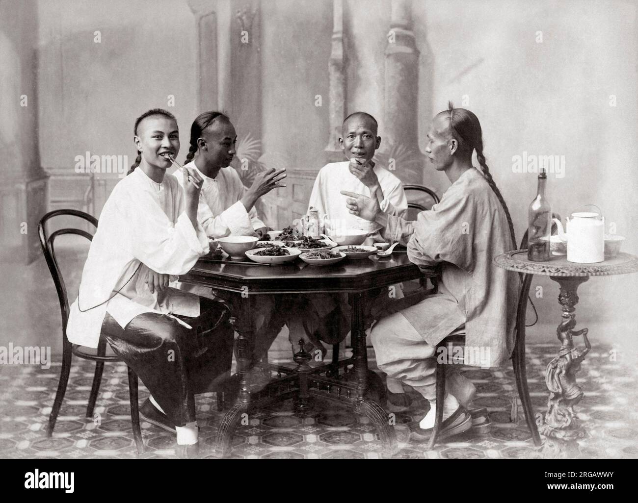 Chinese men eating a meal, c.1890's, China Stock Photo - Alamy