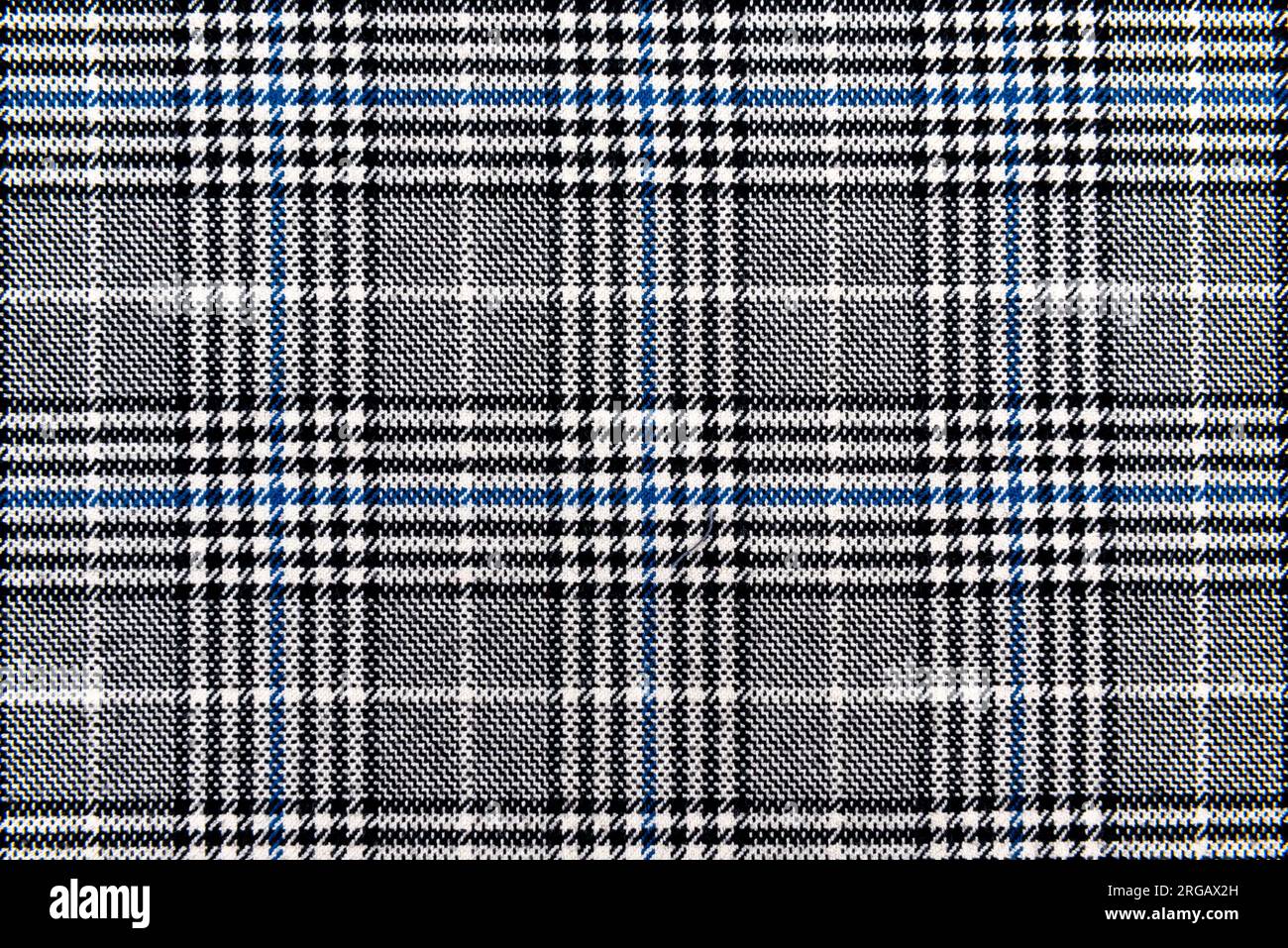 The texture of linen fabric in a large cell of black, blue and white ...