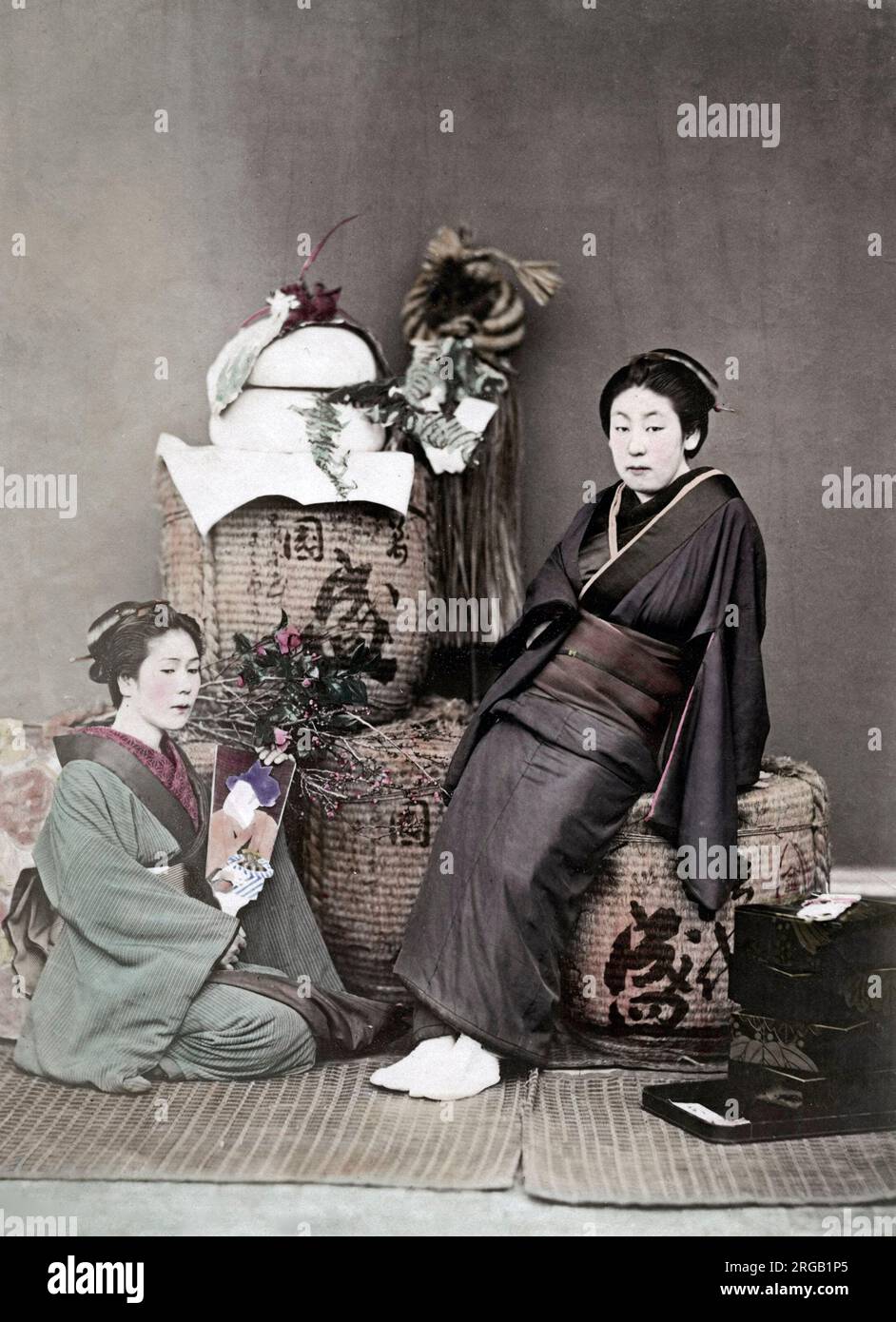 c.1880's Japan - two geishas with baskets and flowers Stock Photo - Alamy